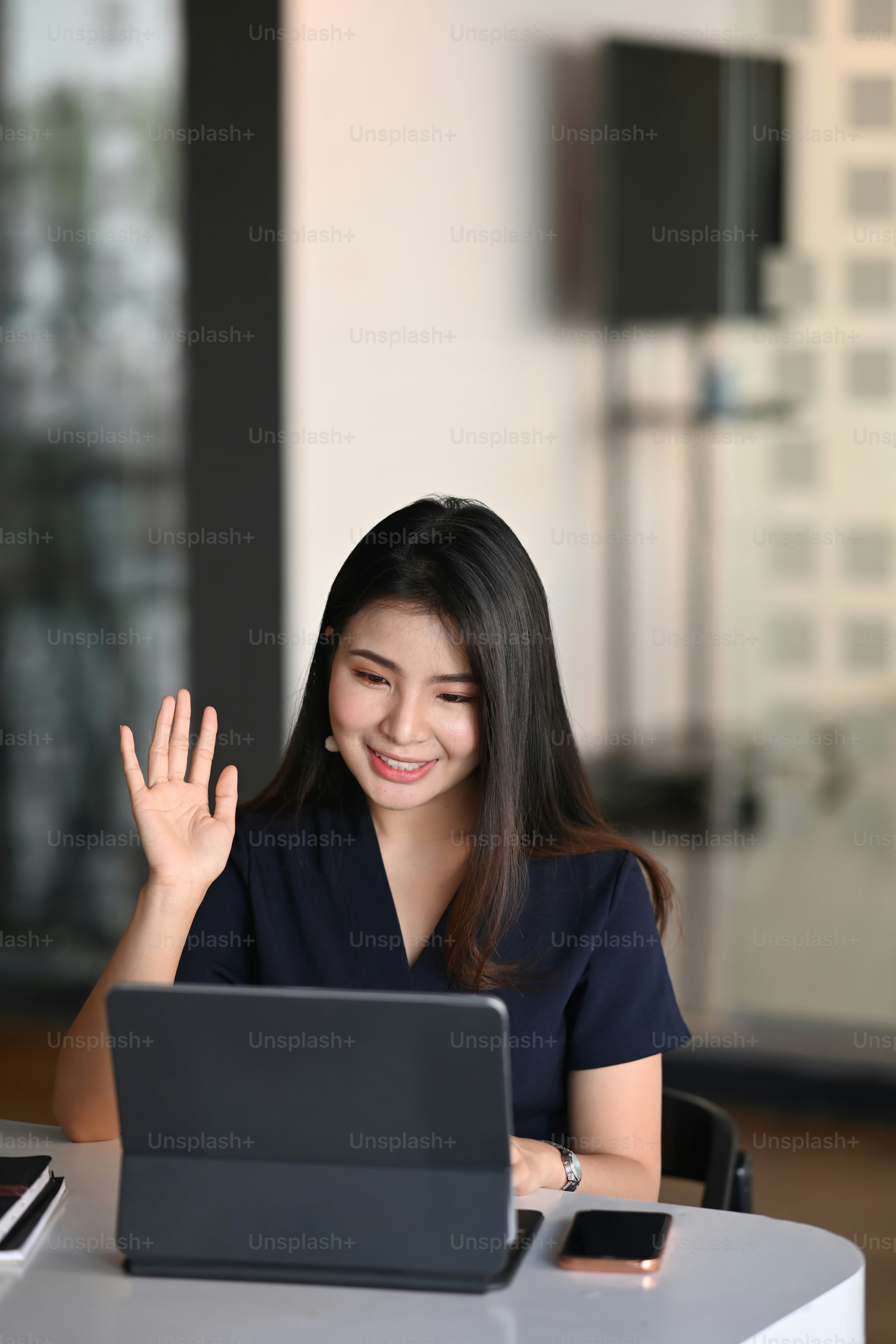 Young Asian businesswoman virtual video conference meeting with ...