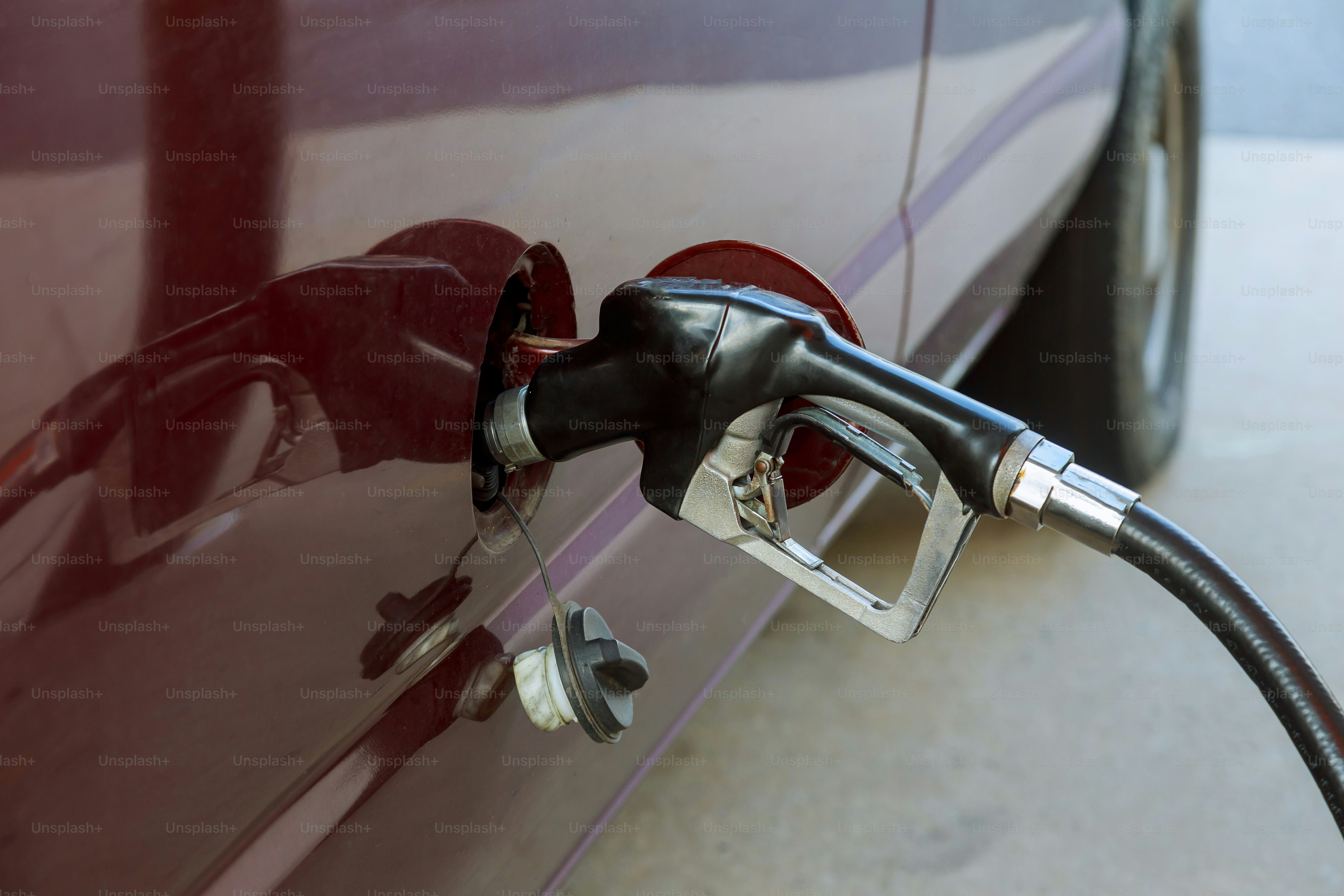 Pumping gasoline fuel in the car transportation at gas station photo ...