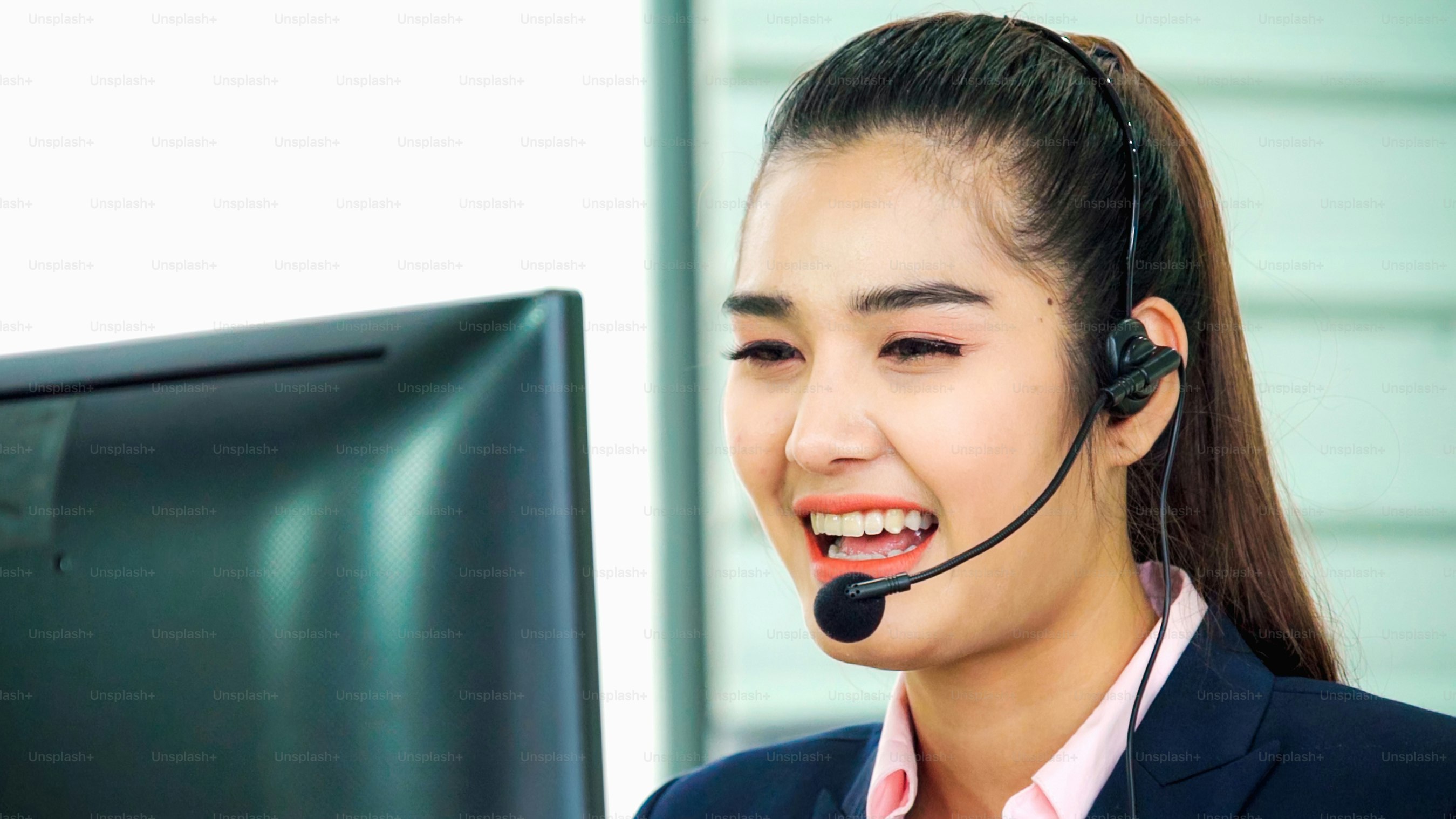 Business people wearing headset working in office to support remote ...