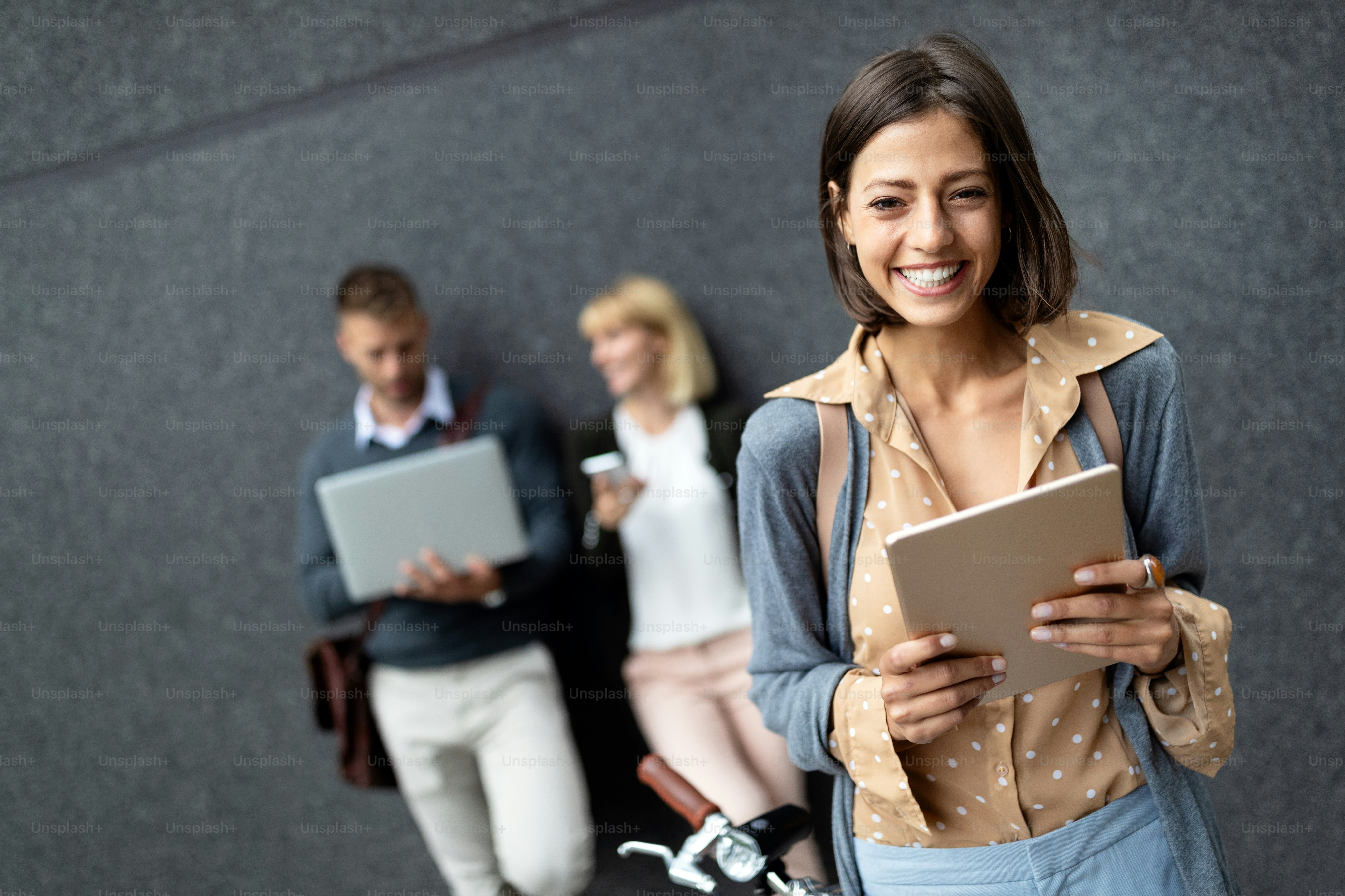 Group of happy young people using electronic devices outdoor photo ...