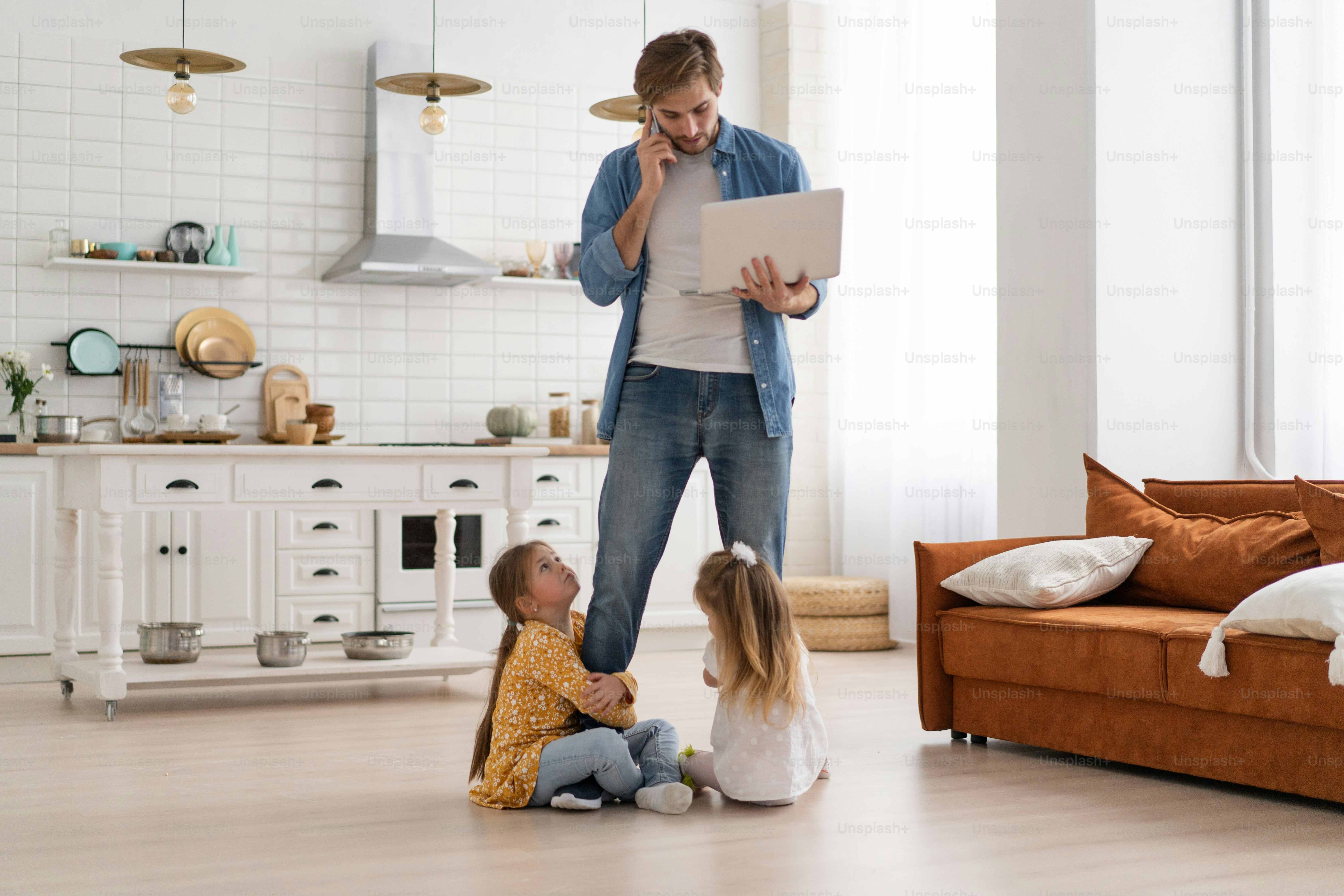 Stressed father working from home with children. Homeschooling, stay home, social distancing ...