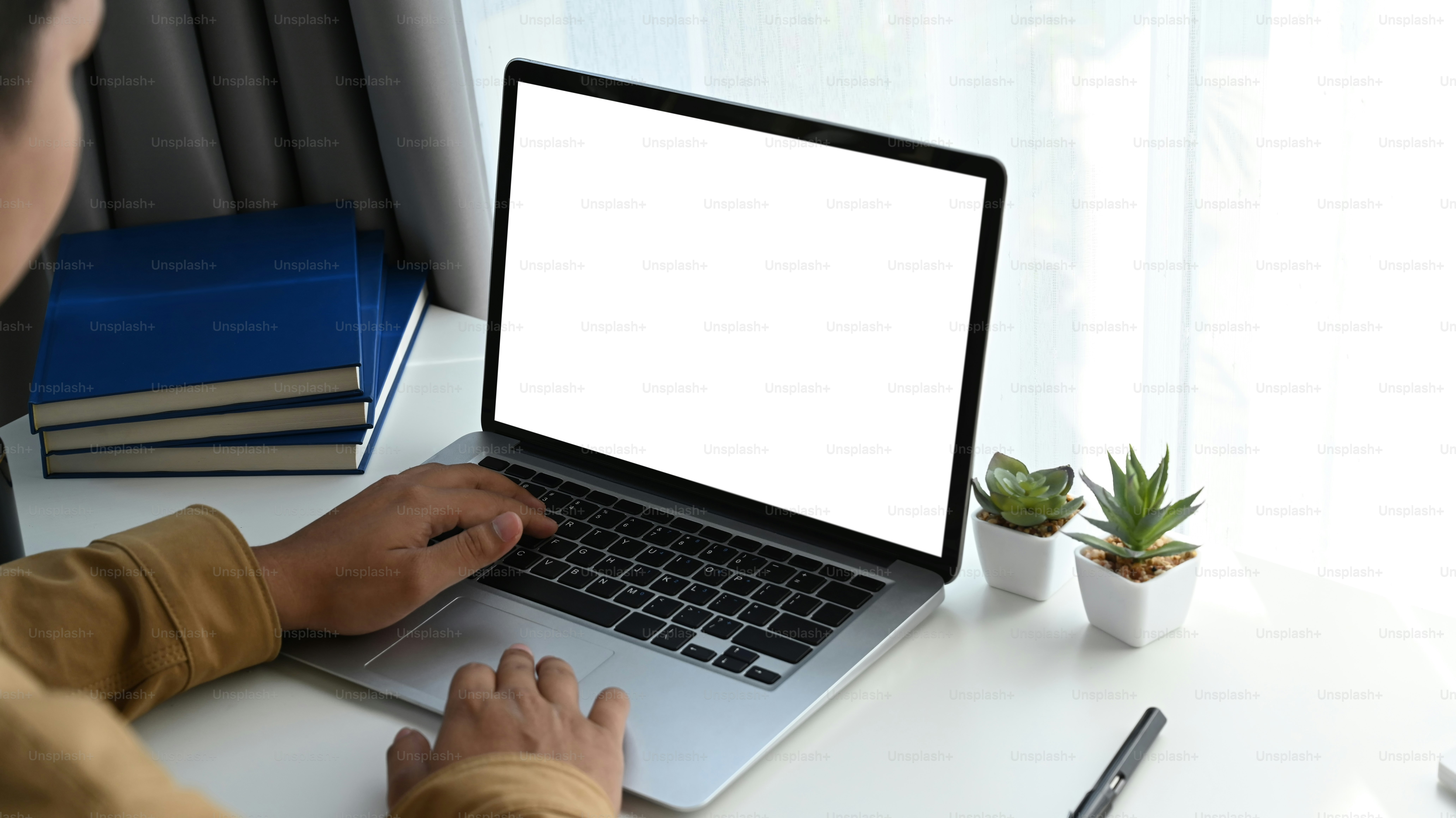 Close up of man using laptop computer during working from home. photo ...