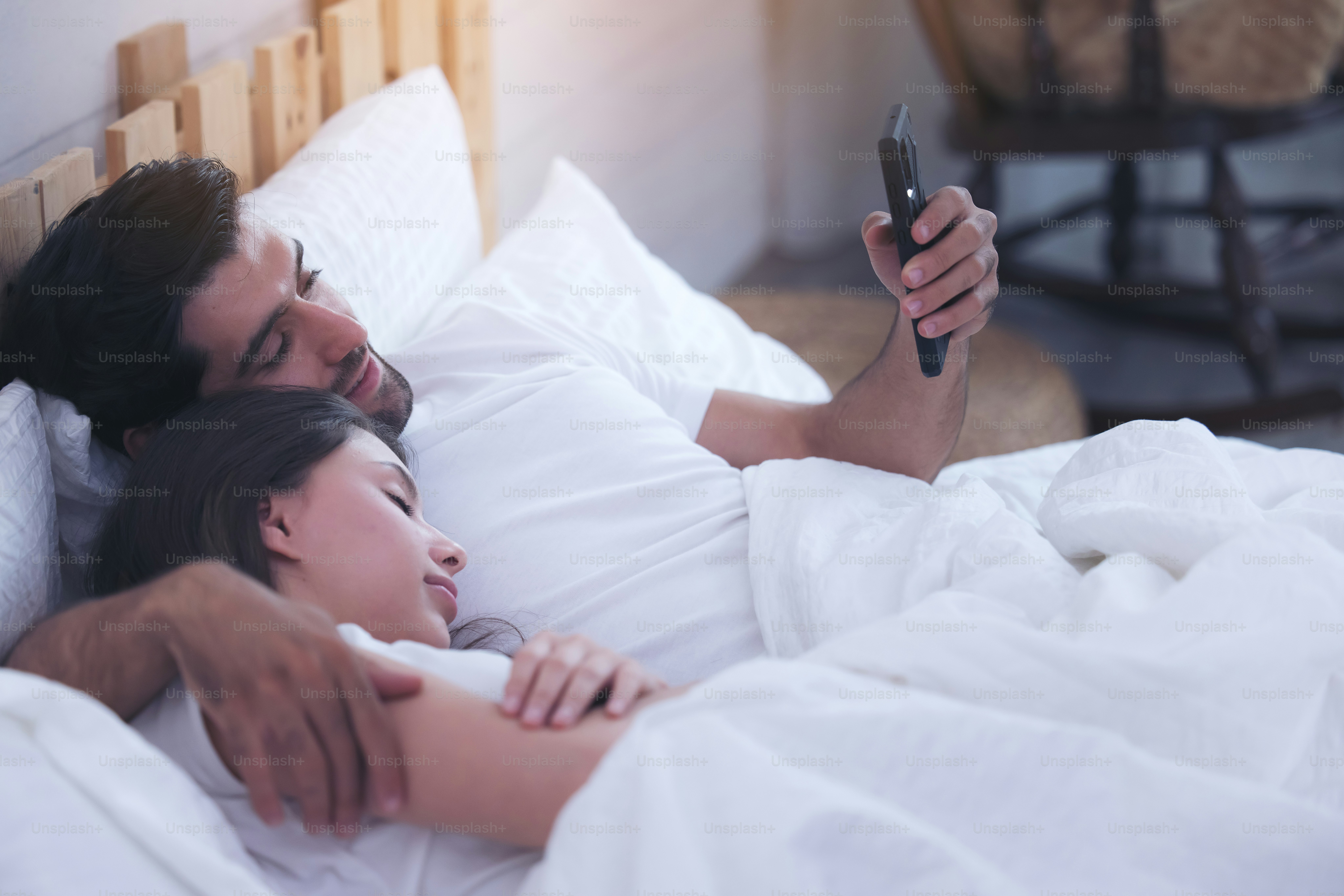 Young Couple In A Bed With Mobile Phones photo – Addiction Image on ...