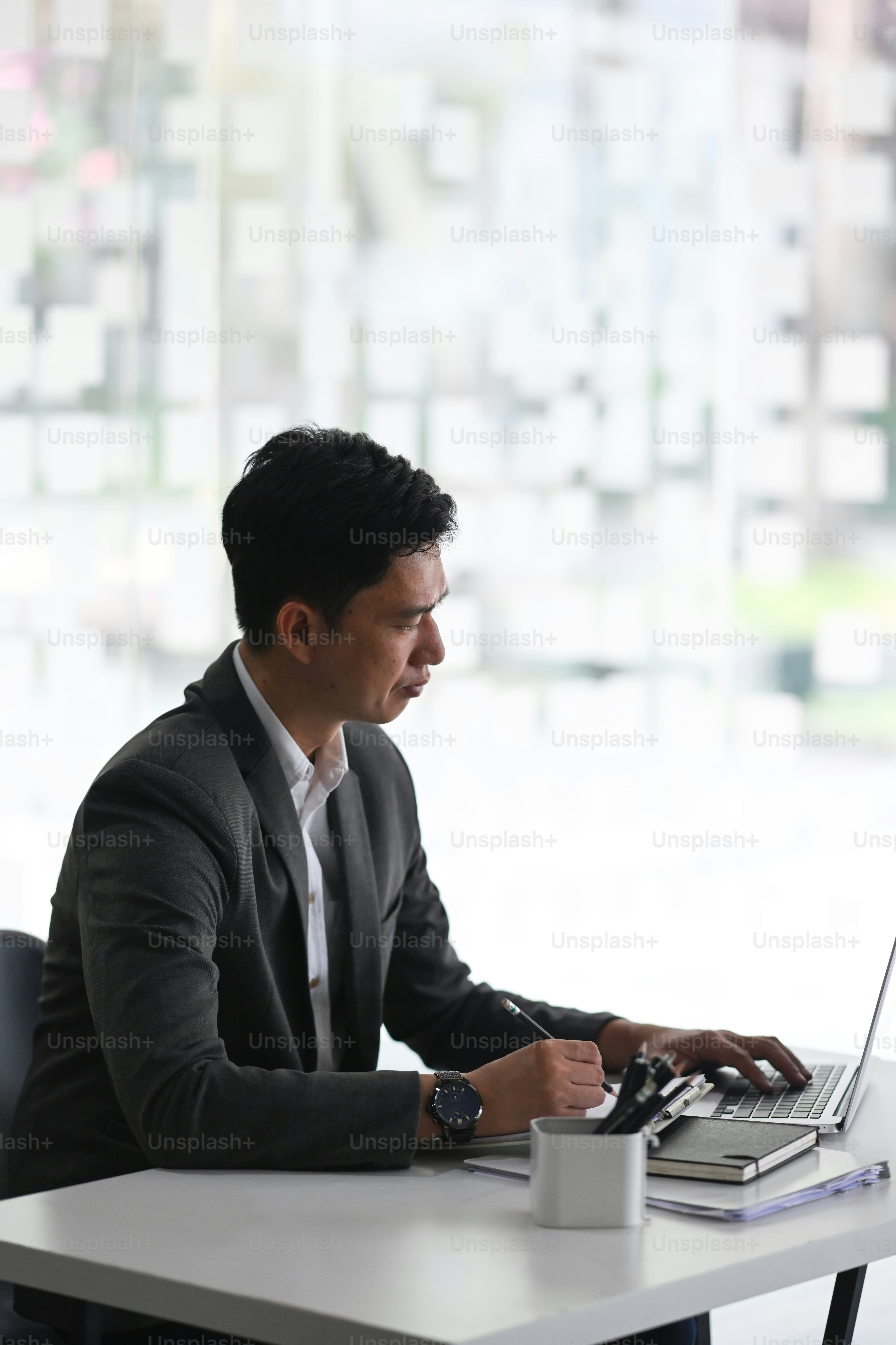 Side view of businessman concentrate working in laptop computer in ...