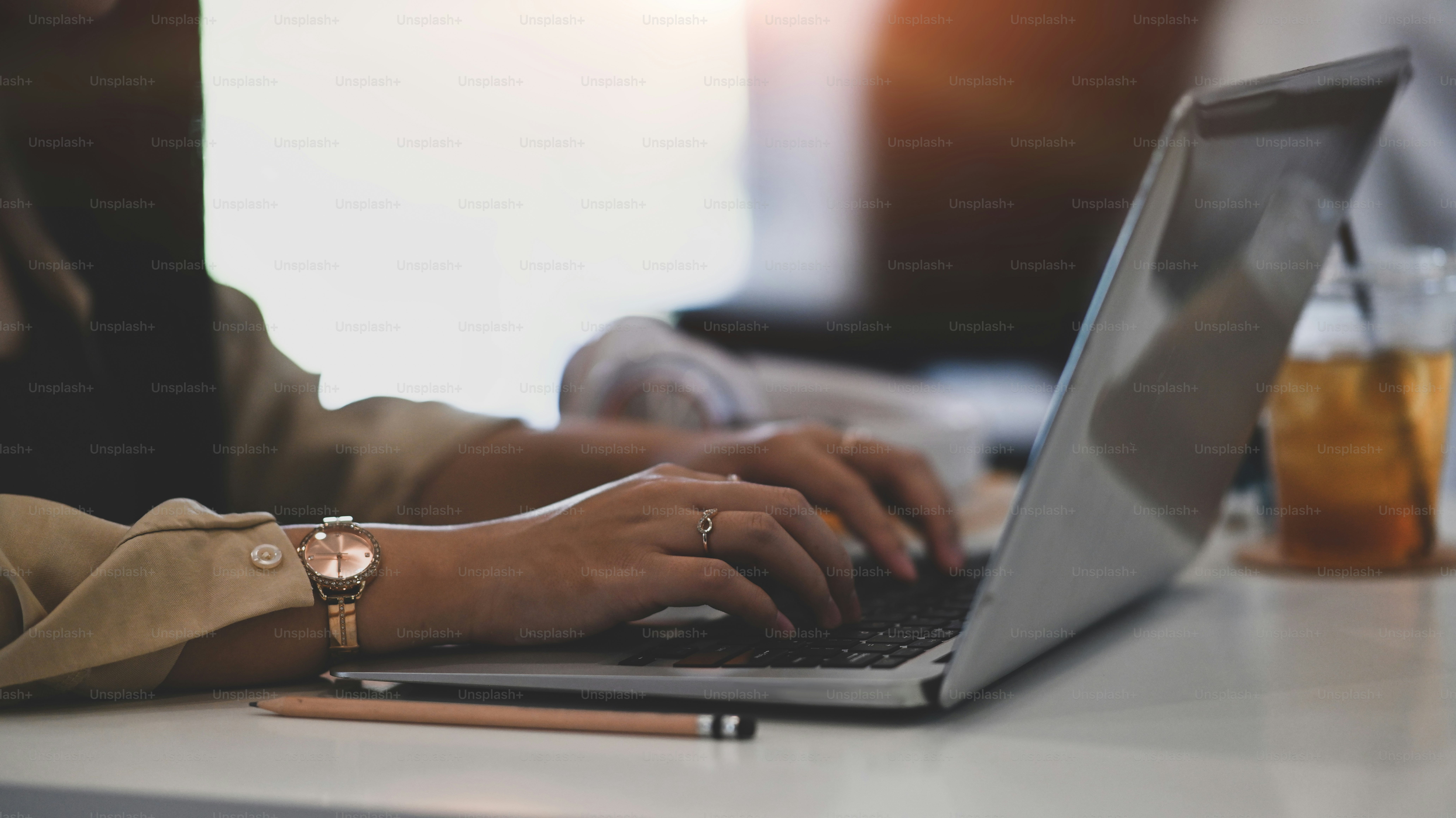 Close up view of of young woman office worker hands typing on laptop ...