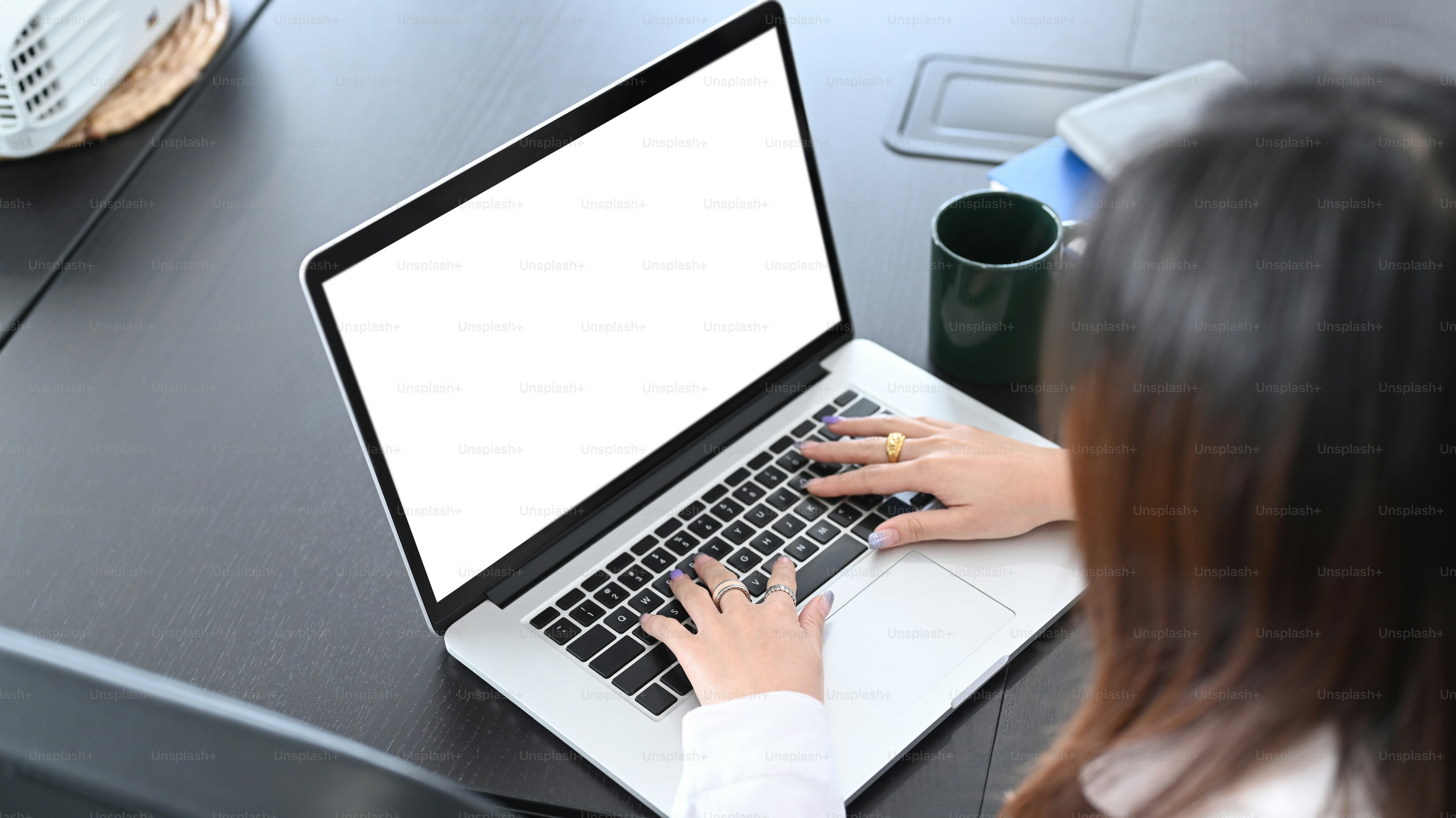 Young female accountant concentrate working on laptop computer at her ...