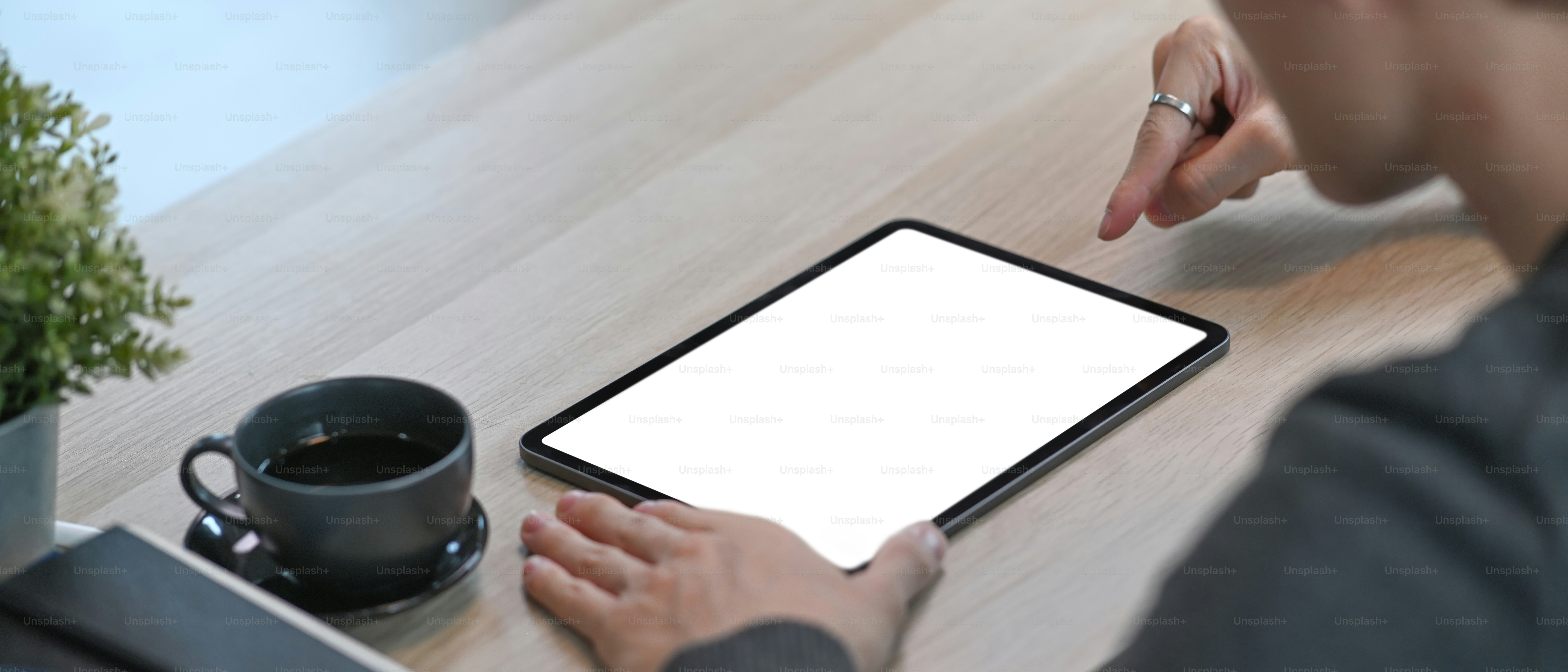 Close up view of young man typing on screen of digital tablet. photo ...