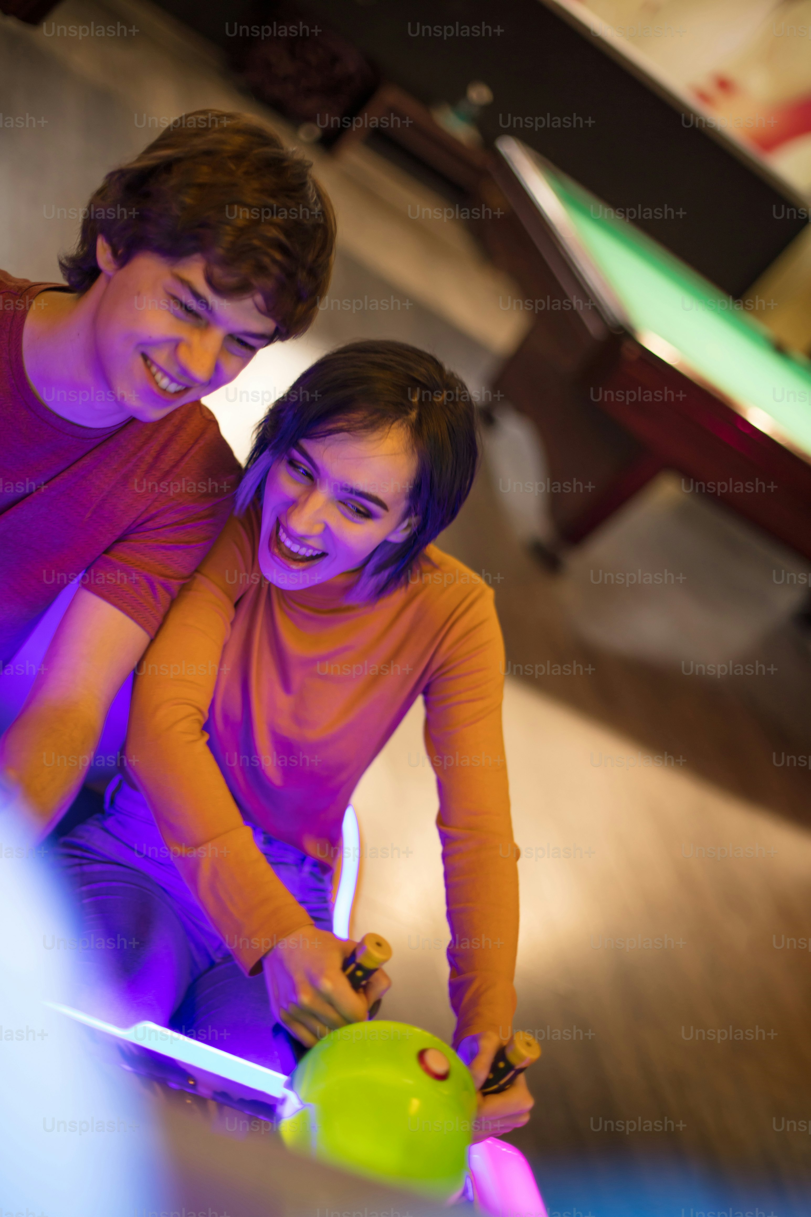 Couple having fun in playroom. Fun and games. photo – Togetherness ...