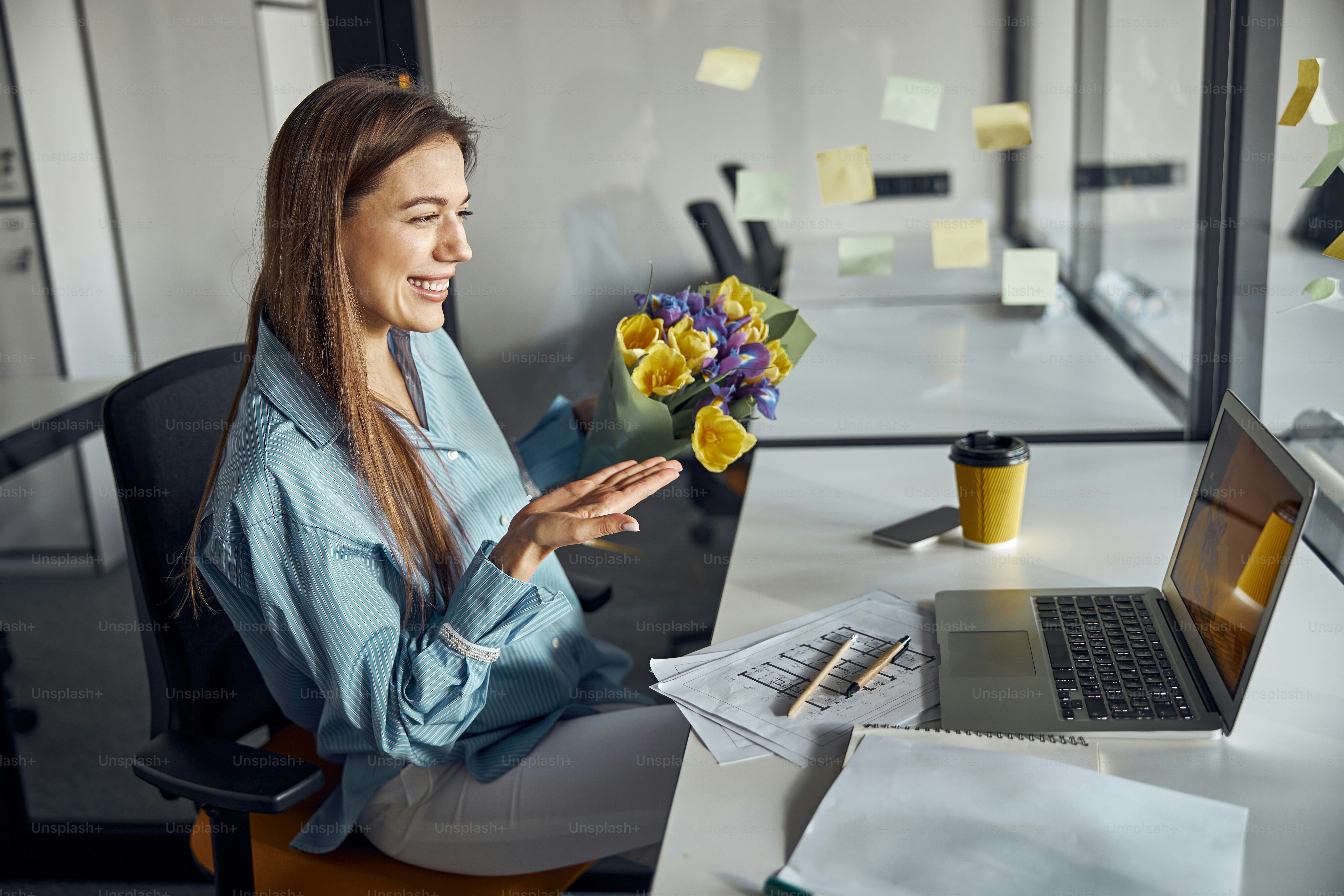 Side view of a high-spirited lady engineer with a bunch of beautiful ...