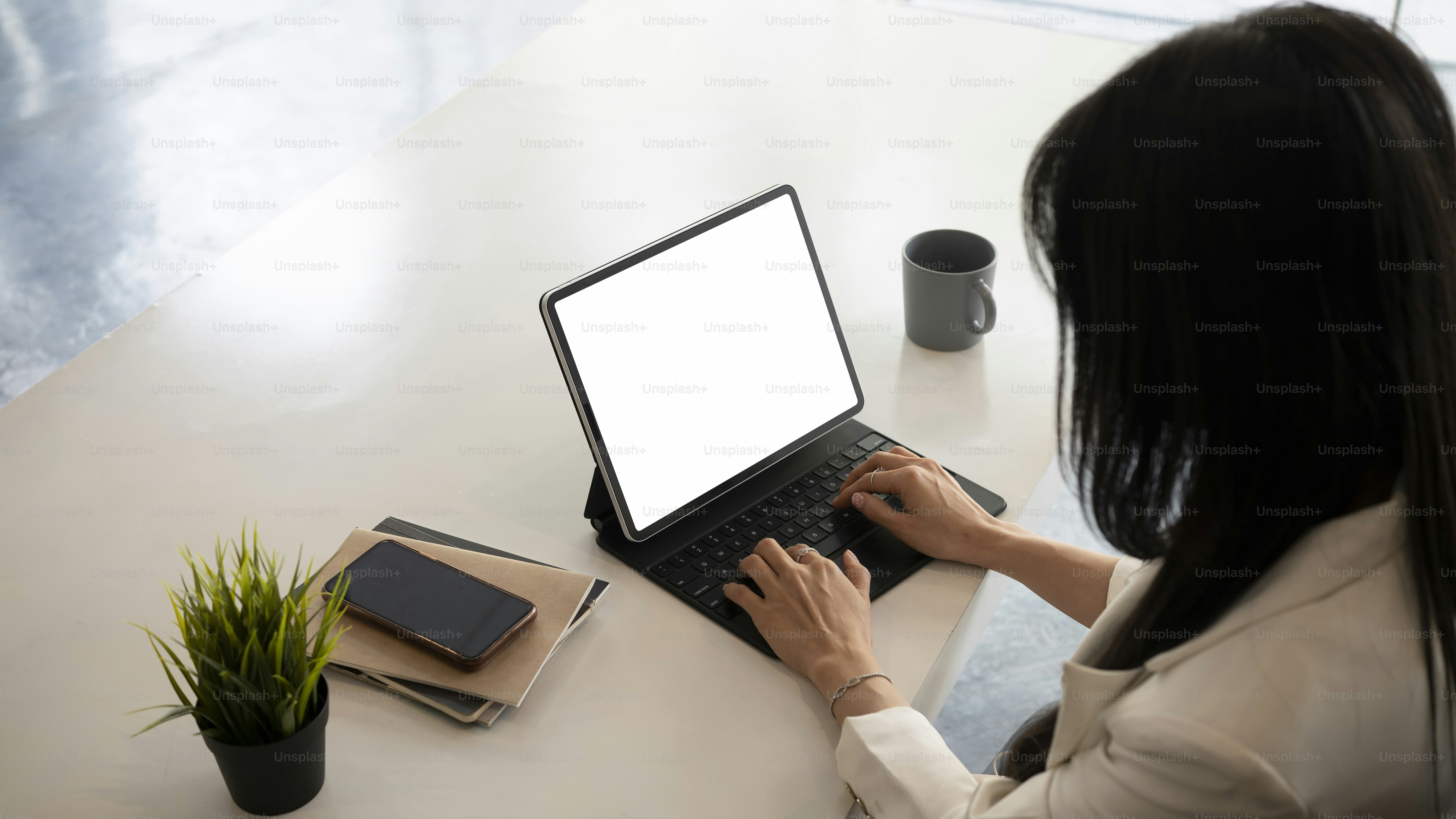View over businesswoman shoulder working with computer tablet while ...