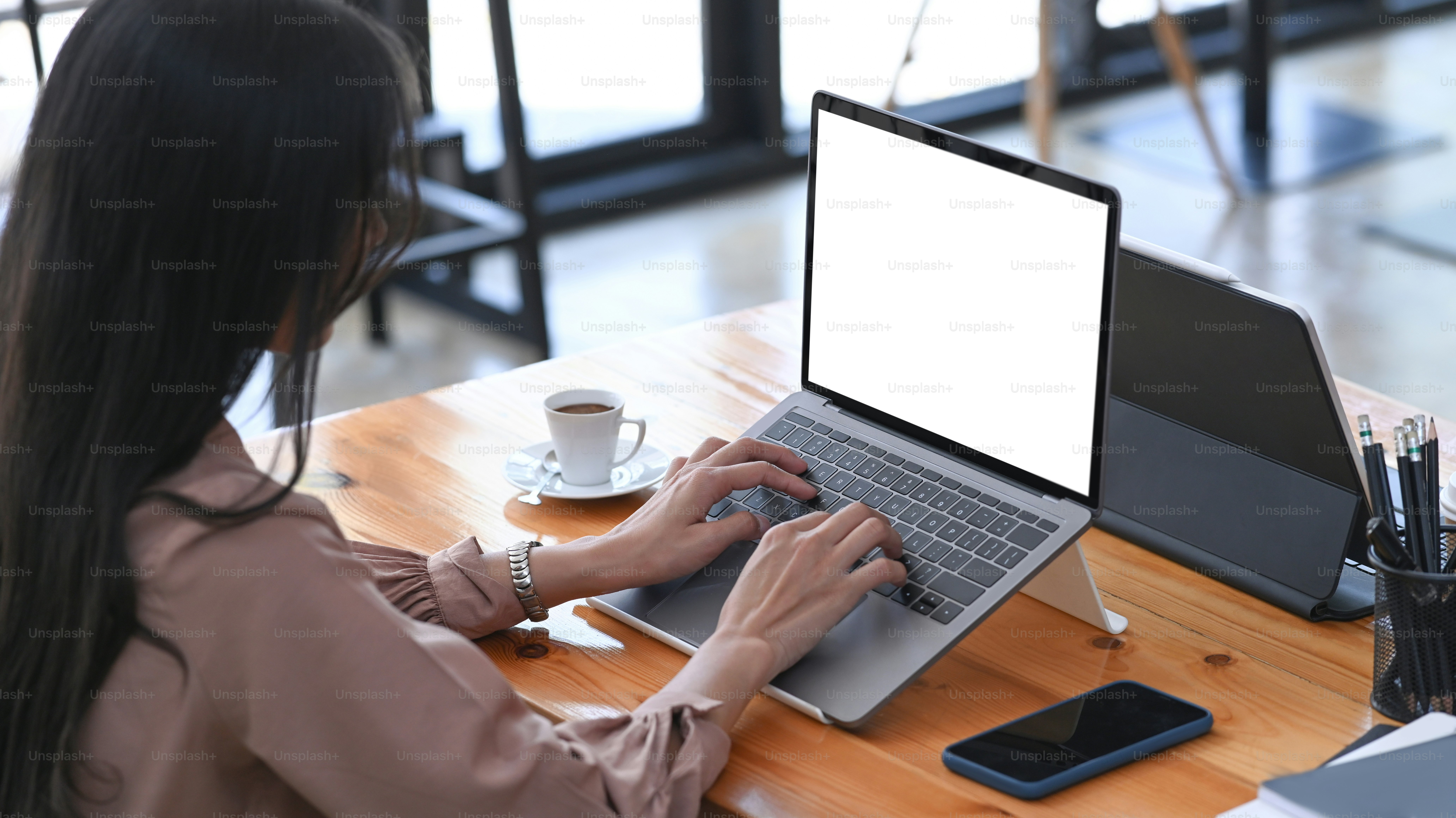 Side view of young woman office worker working with computer laptop ...
