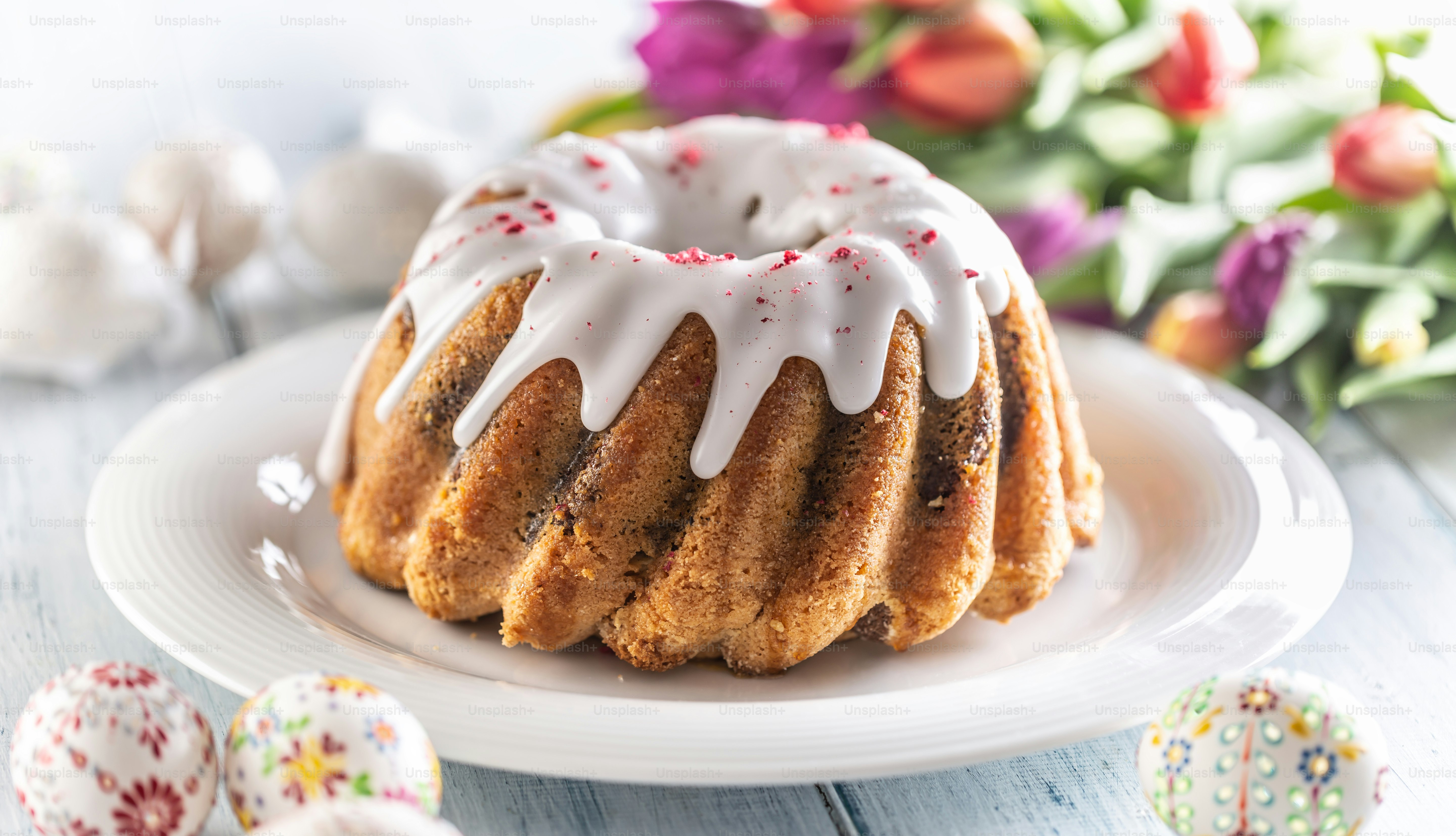 Festive easter marble cake with icing sugar hand-decorated eggs and ...