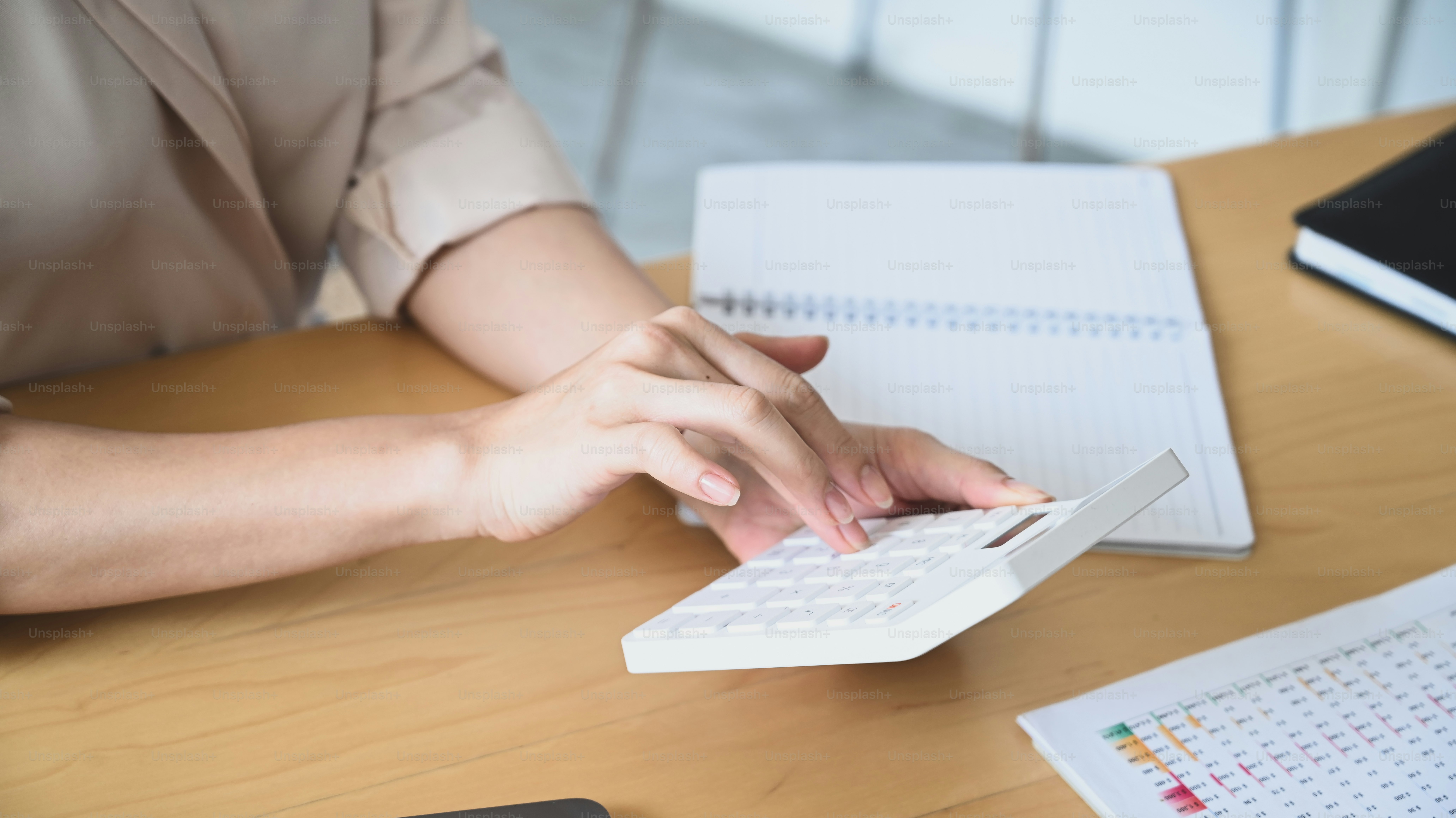 Close up view of woman accountant calculate business data at office ...