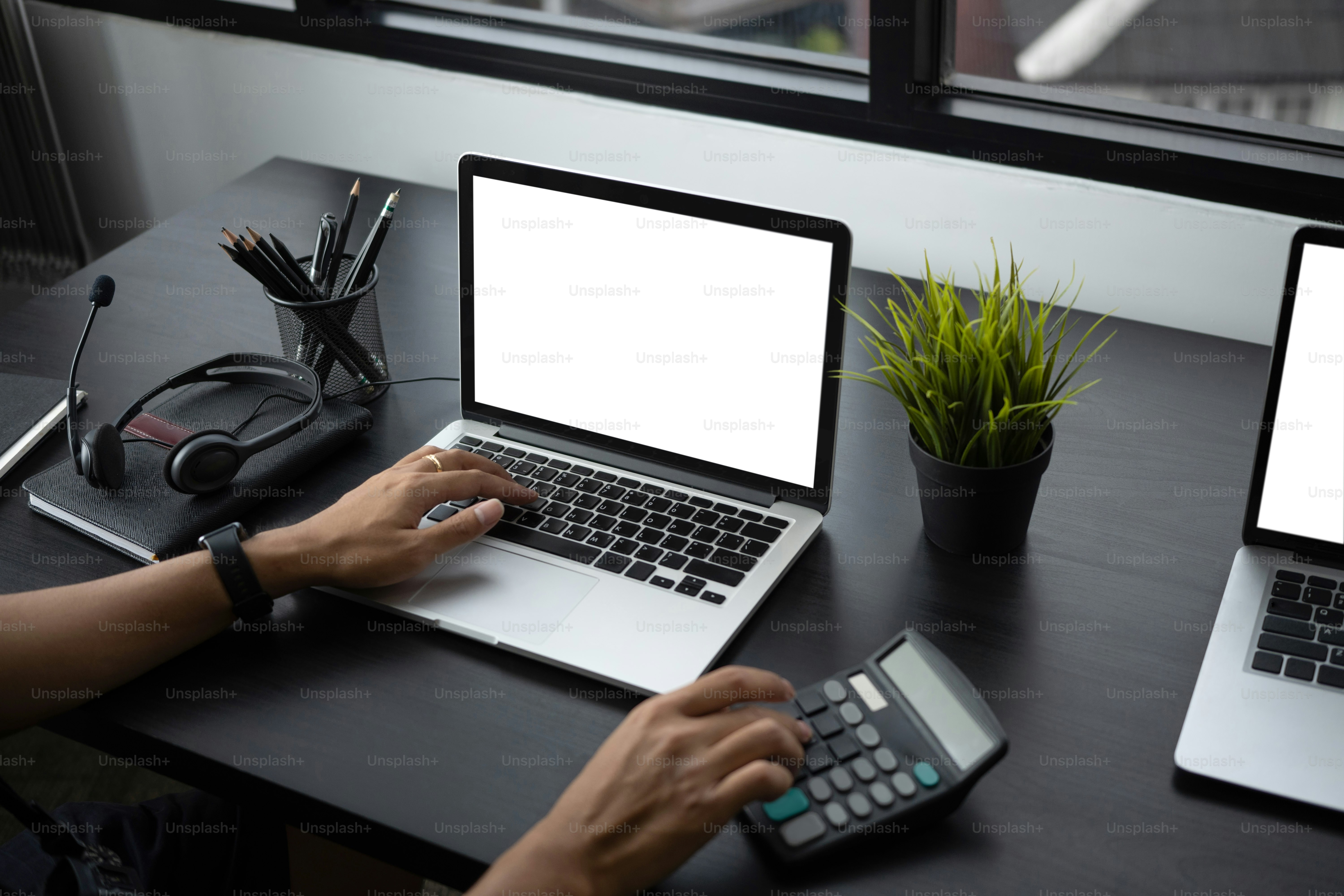Close up view of female accountant using calculator and working with ...