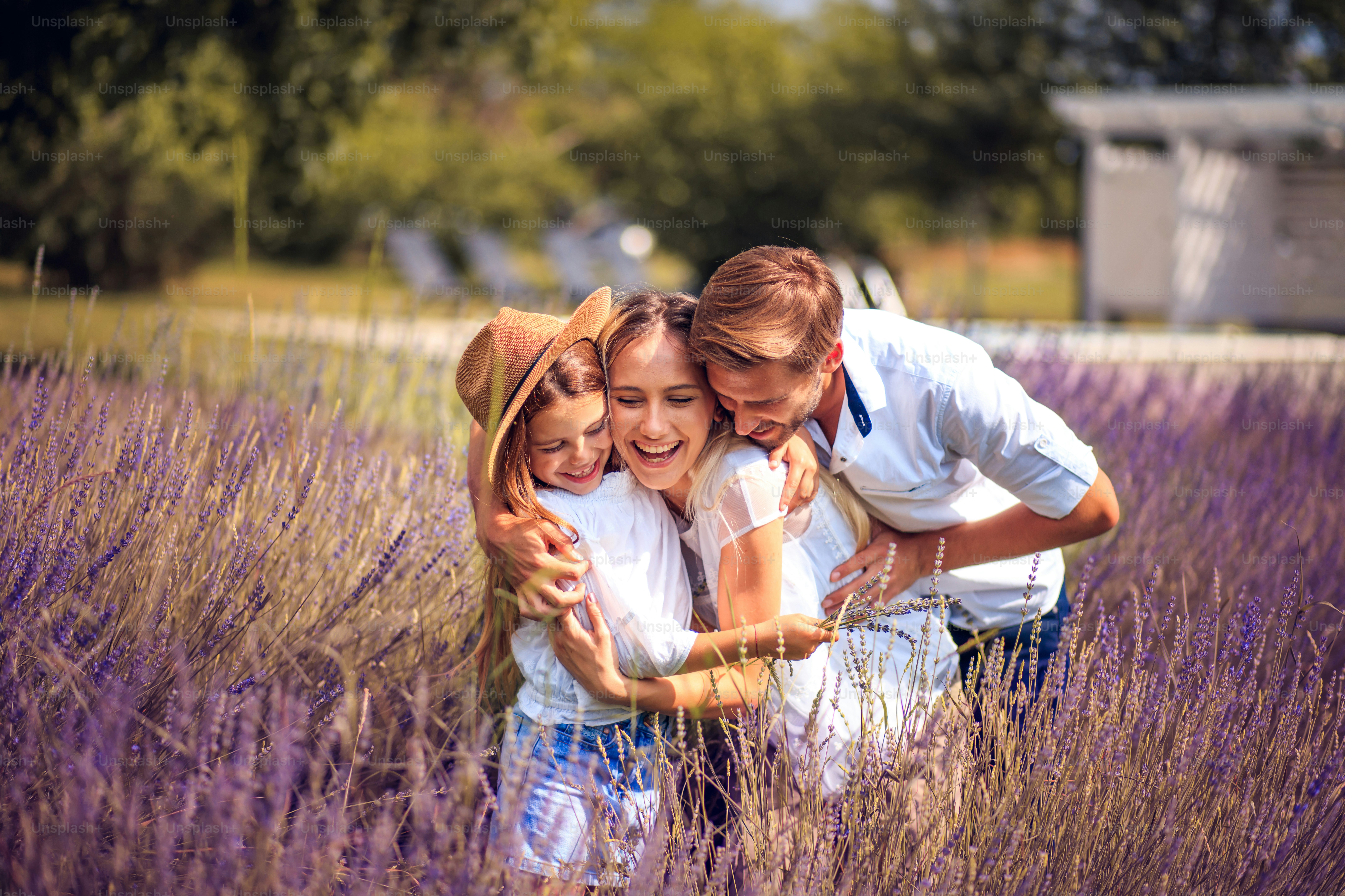 Young family in lavender field. photo – Springtime Image on Unsplash