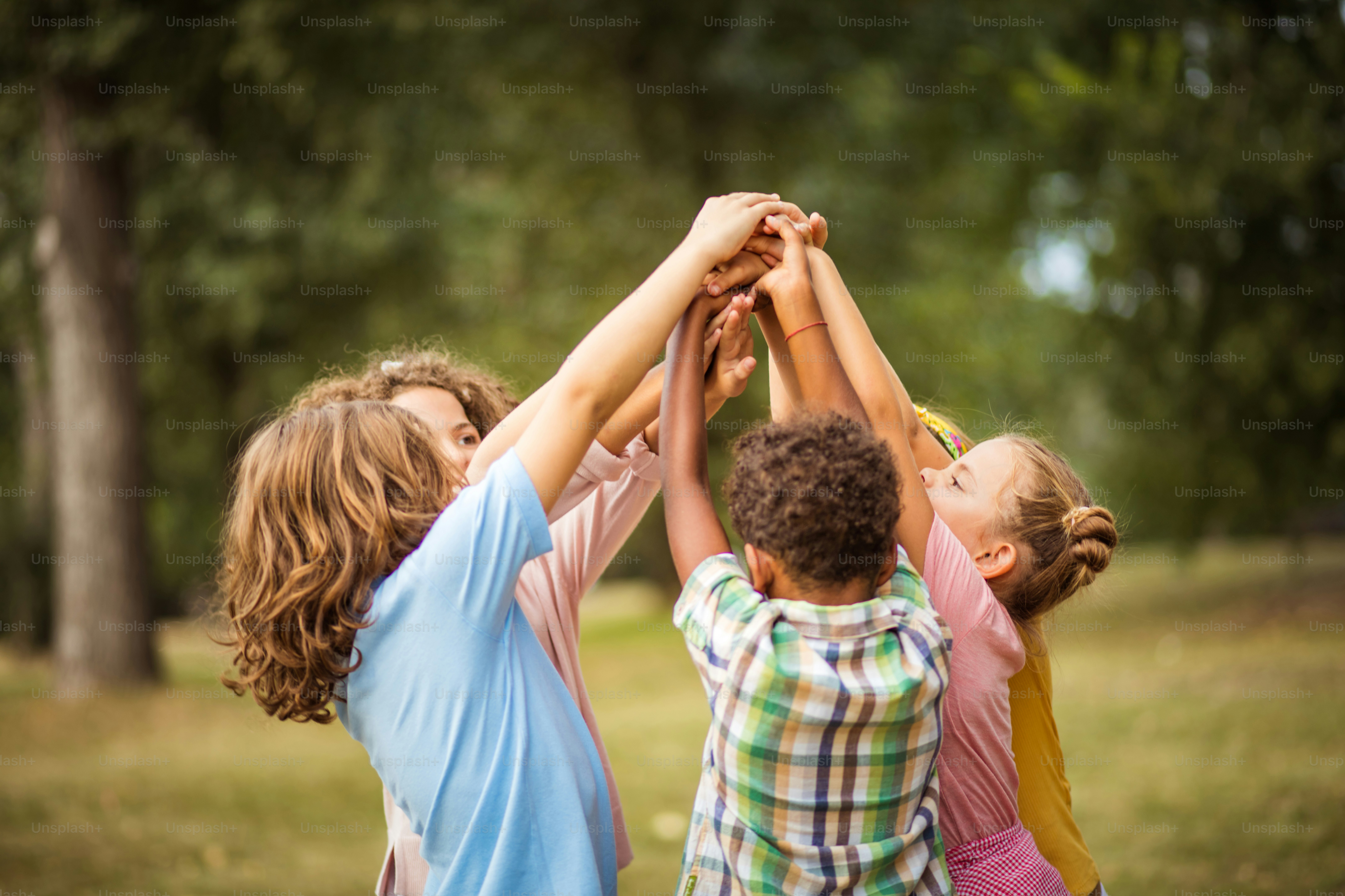 Fun time. Group of school kids having fun in nature. photo – Happiness ...