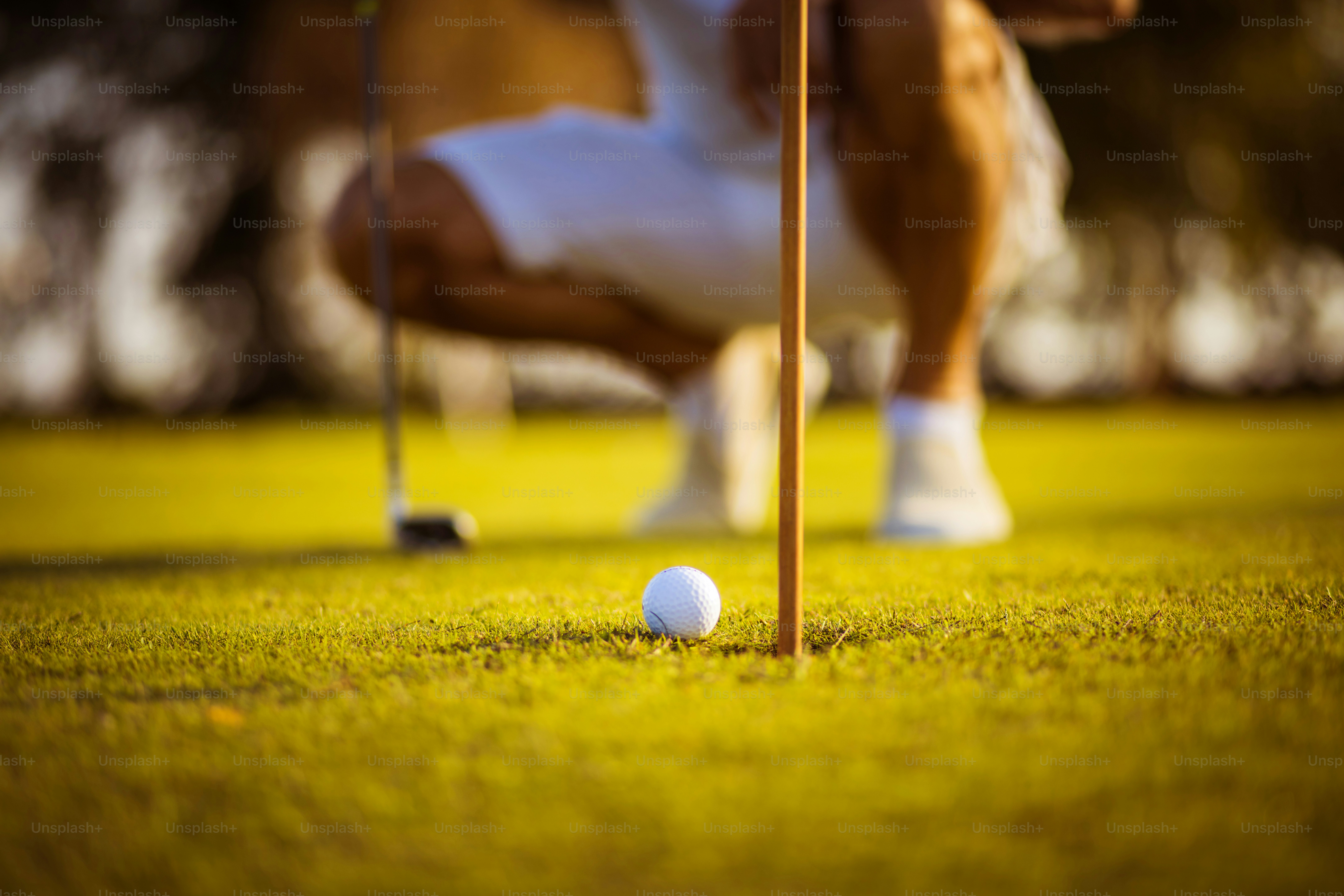 Senior man playing golf. Close up. Focus is on ball. photo – Golf ball ...