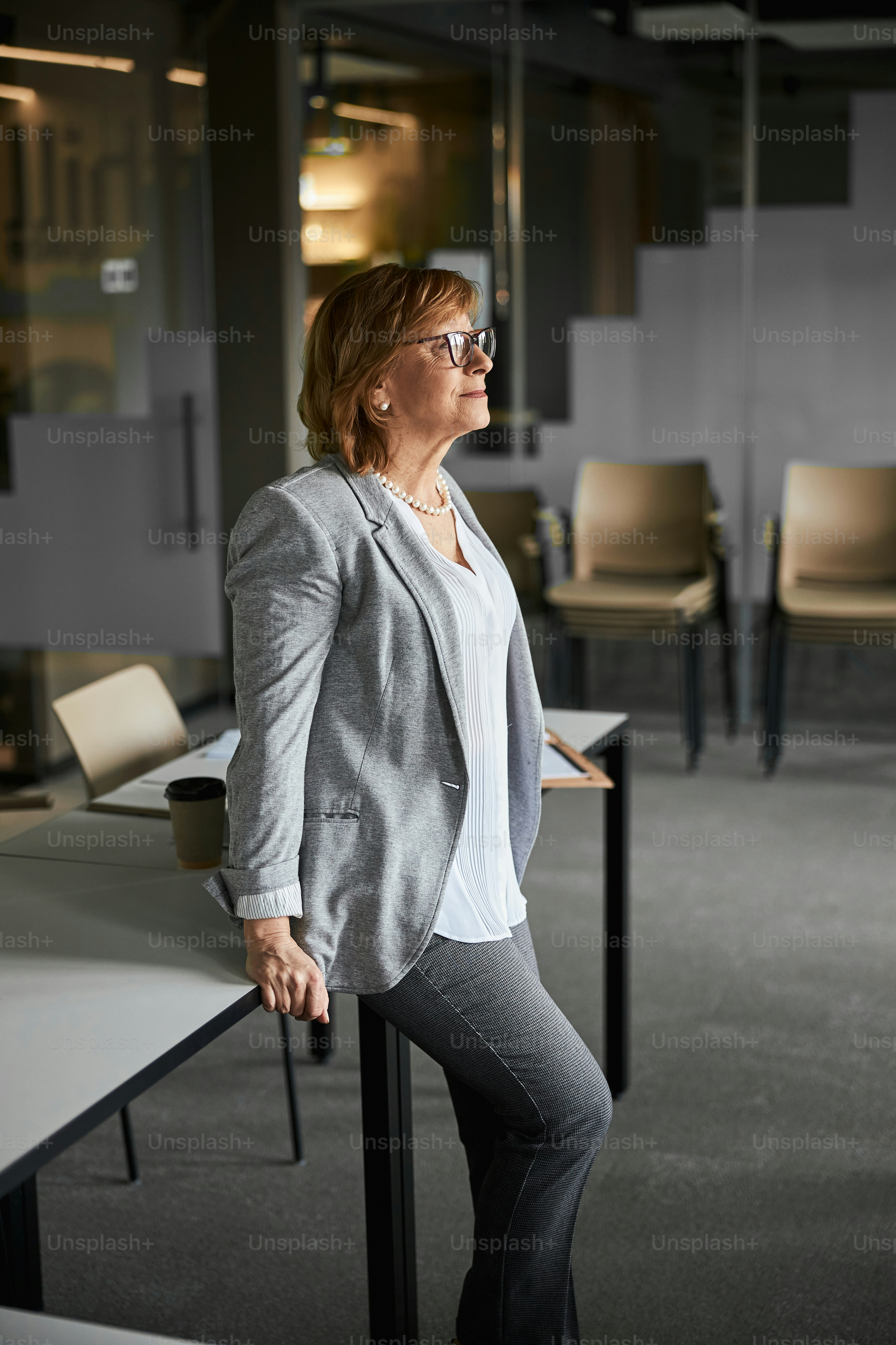 Business lady in stylish glasses and official clothing resting against ...