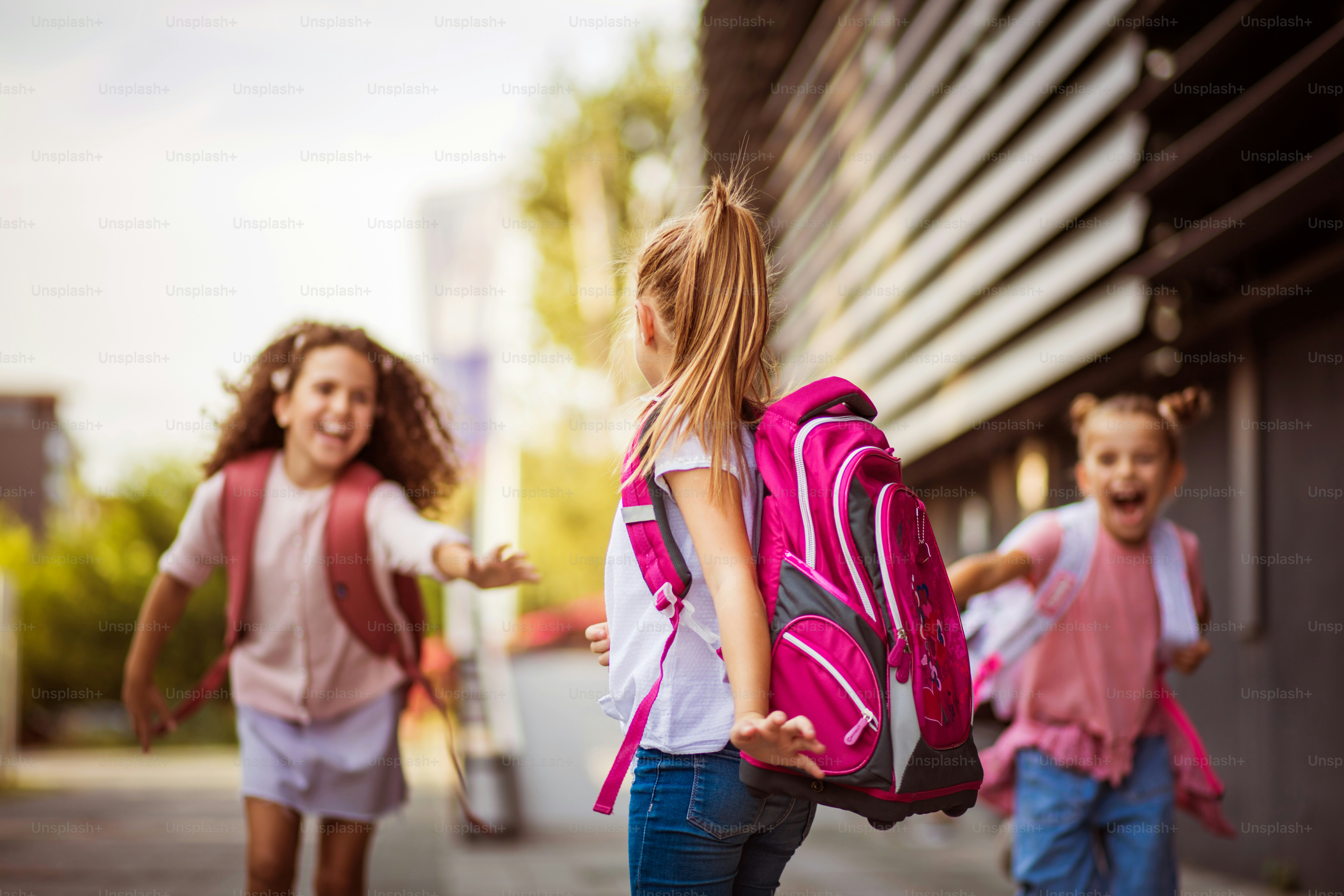 Three school girls outside. photo – Running Image on Unsplash