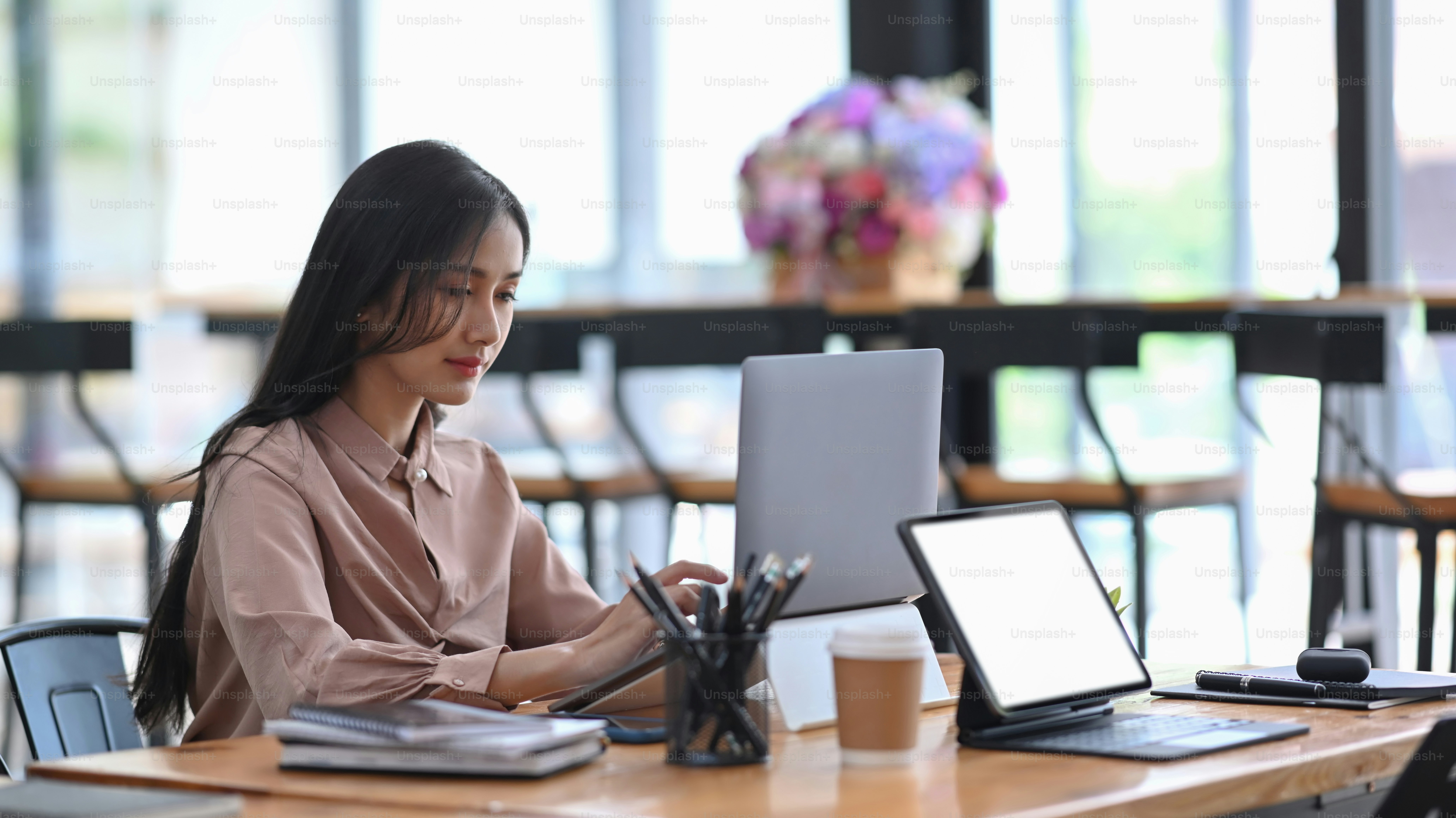 Young businesswoman concentrate working on computer laptop at office ...
