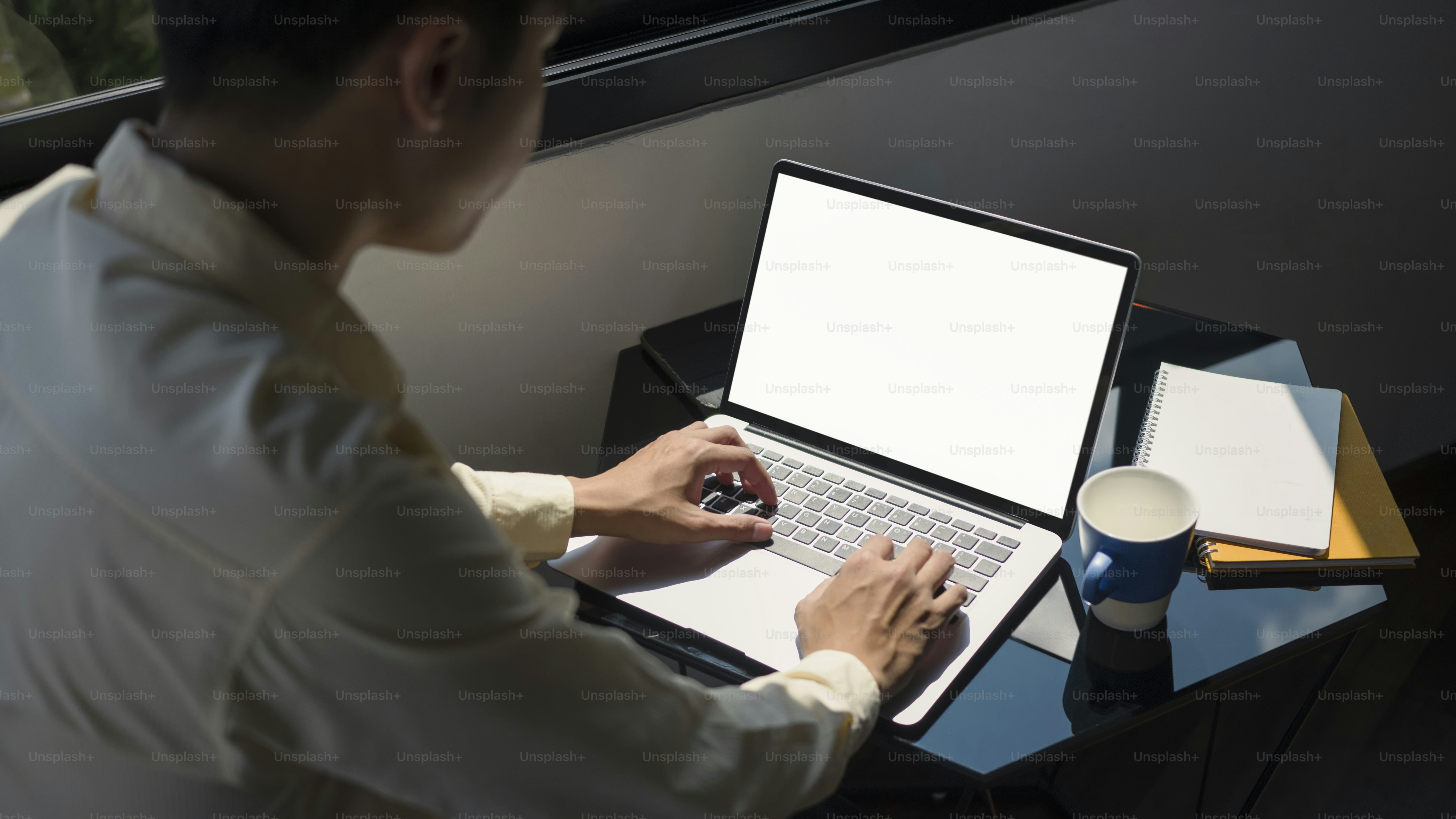Side view of concentrate businessman working on computer laptop at ...