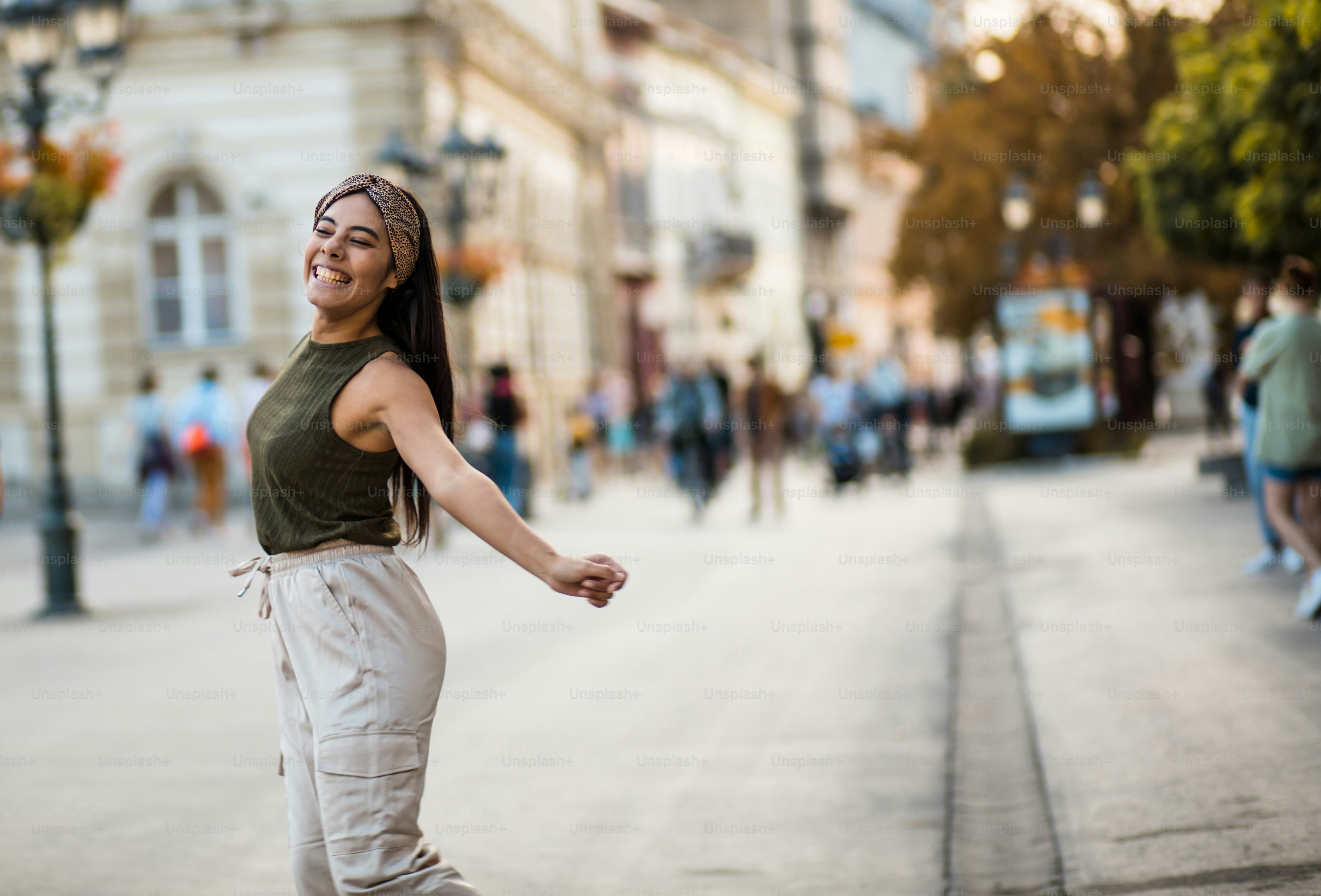 Woman dancing on the street. photo – Serbia Image on Unsplash
