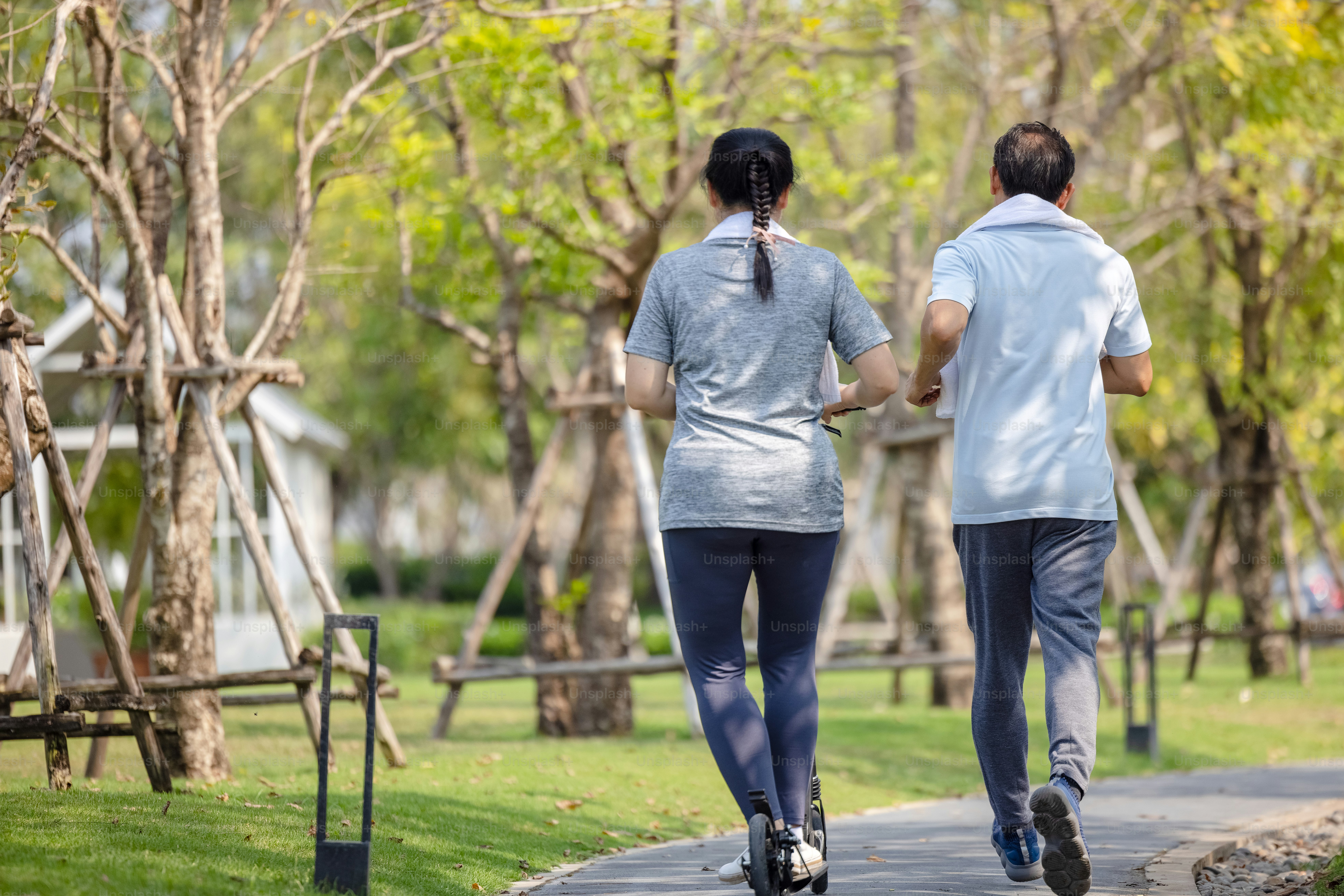 Couple workout and exercise with scooter together outdoor in park photo ...