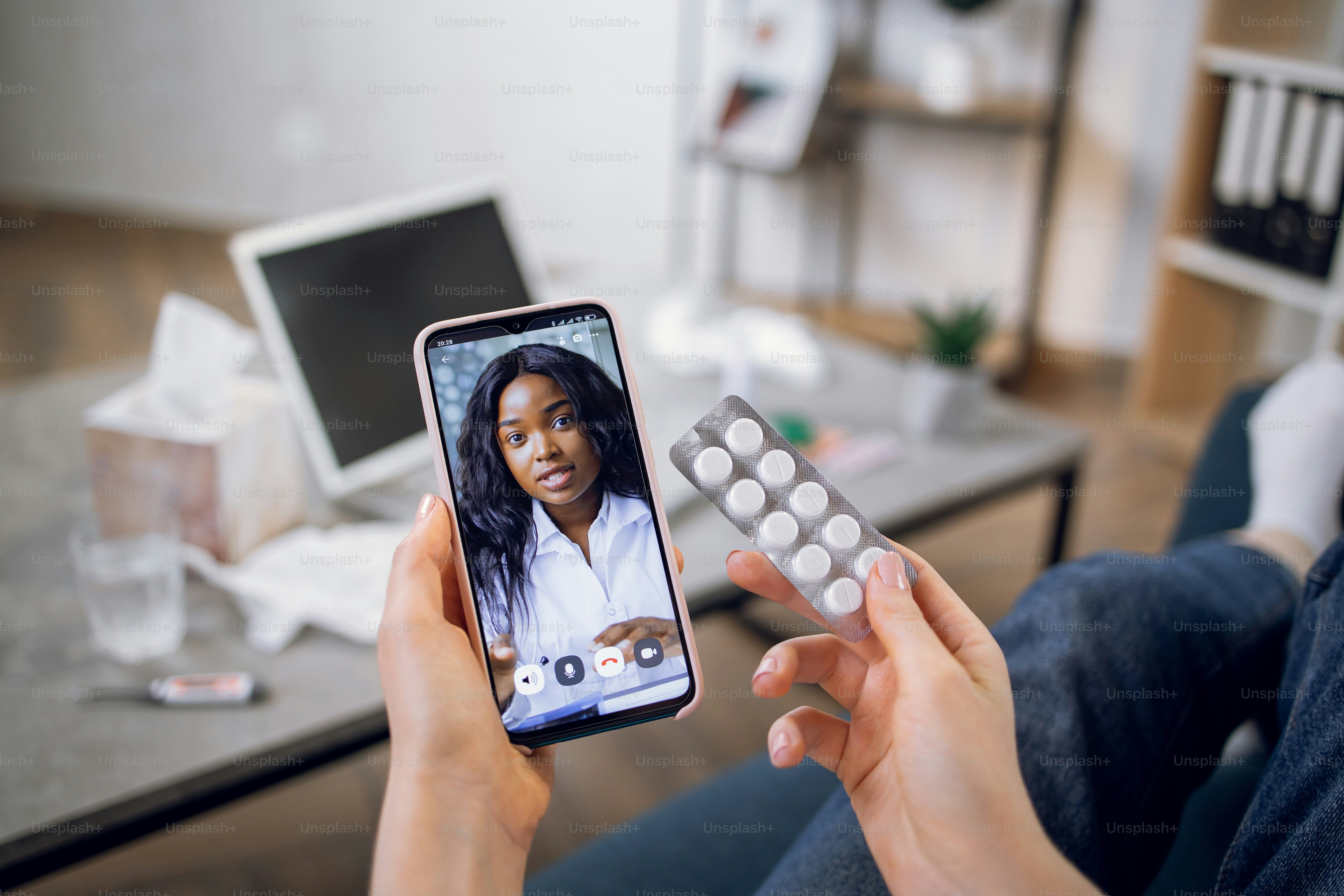 Phone screen view of African woman doctor therapist on video conference ...
