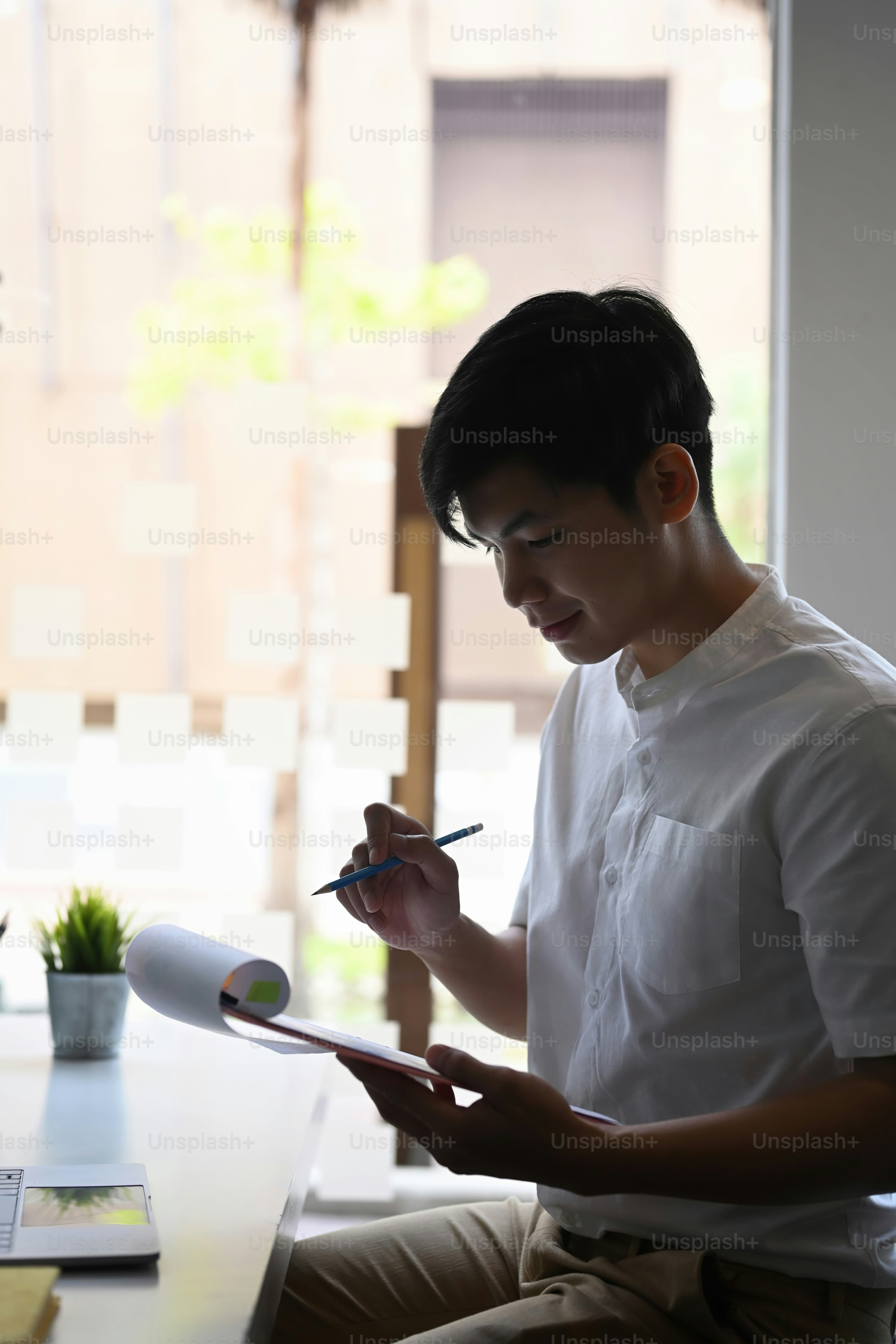 Portrait of calm businessman analyzing financial data at his office ...