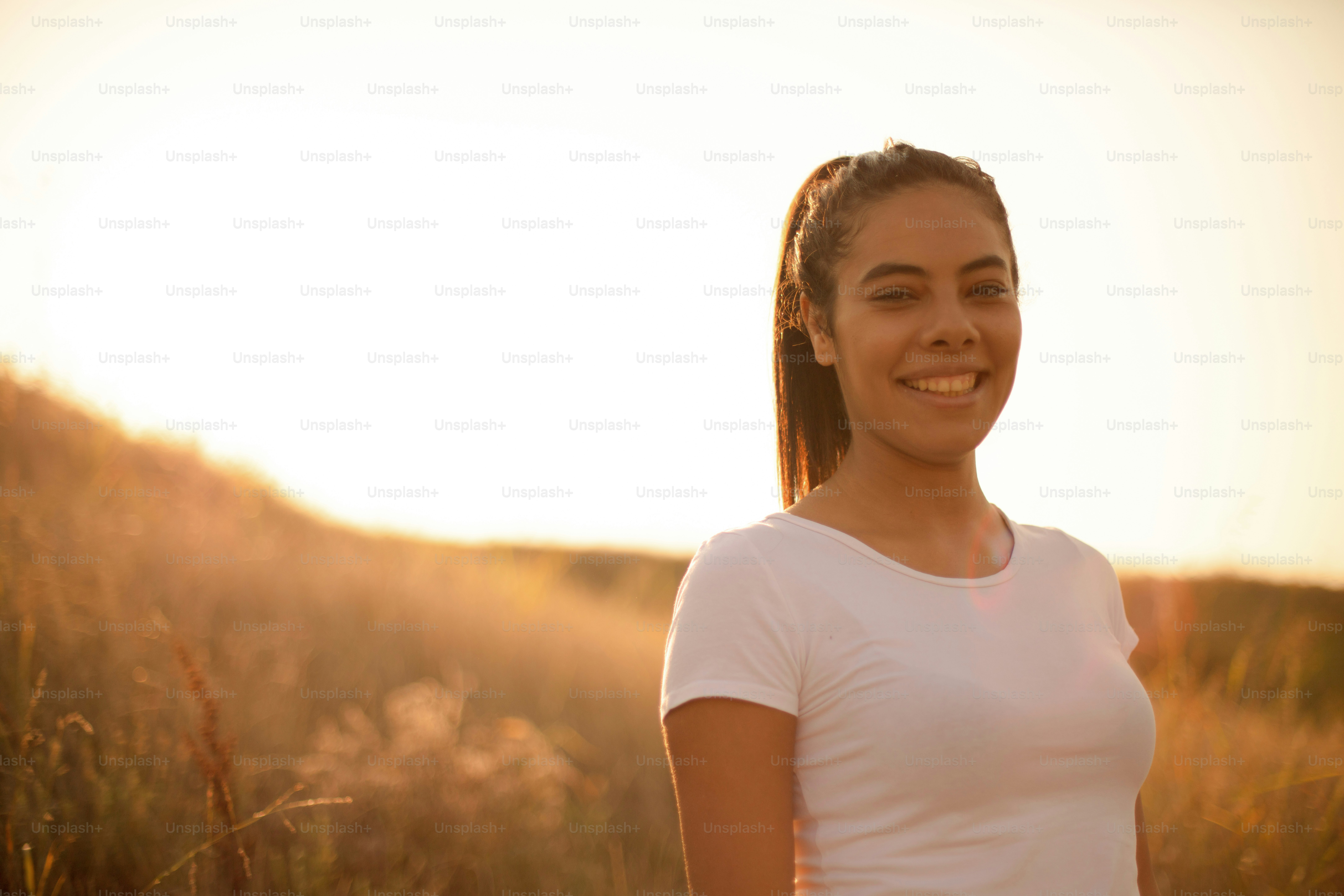Young woman standing outside on a sunny day. photo – Healthy lifestyle ...