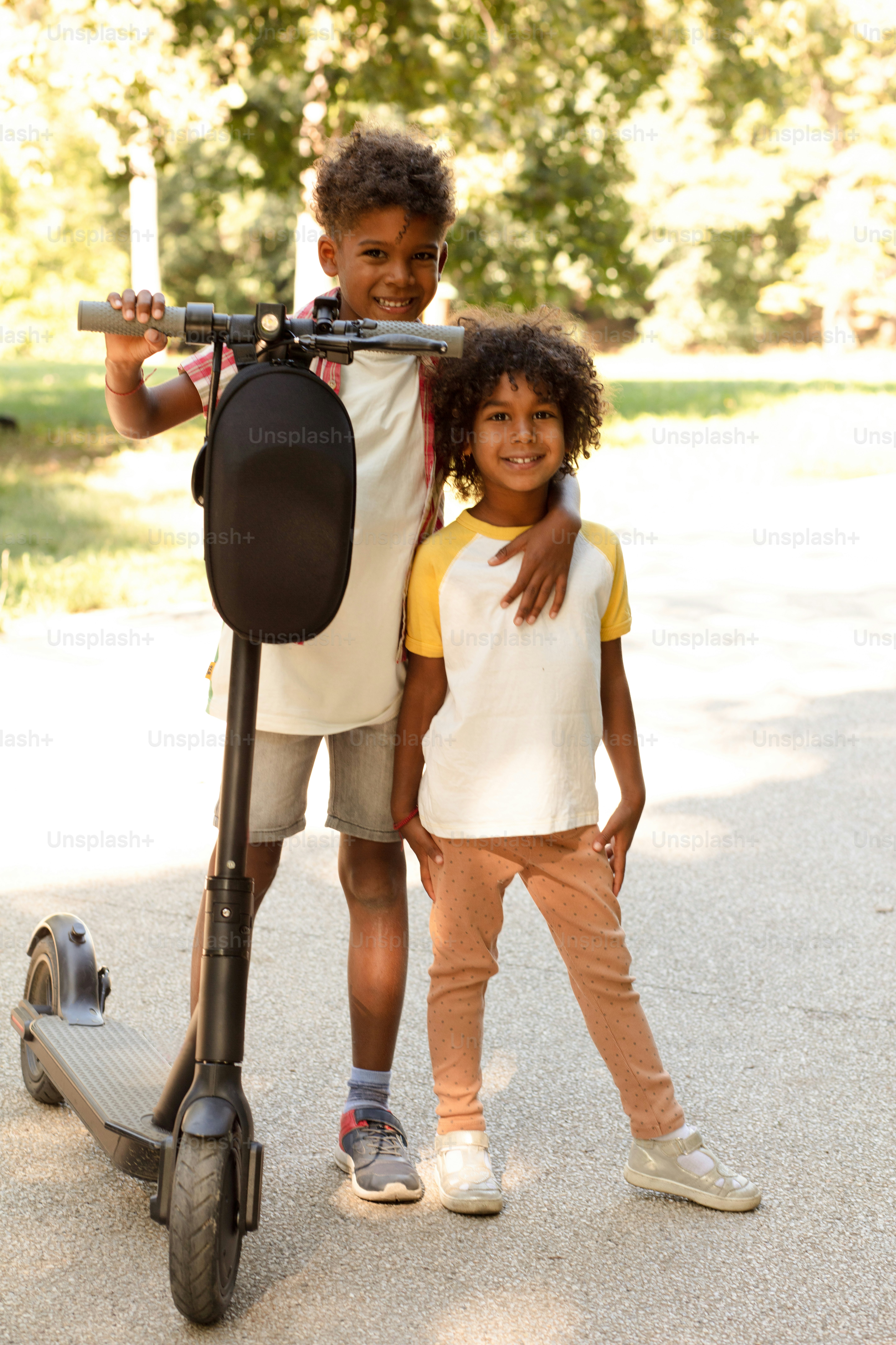Portrait of little kids. African American brother and sister in nature ...