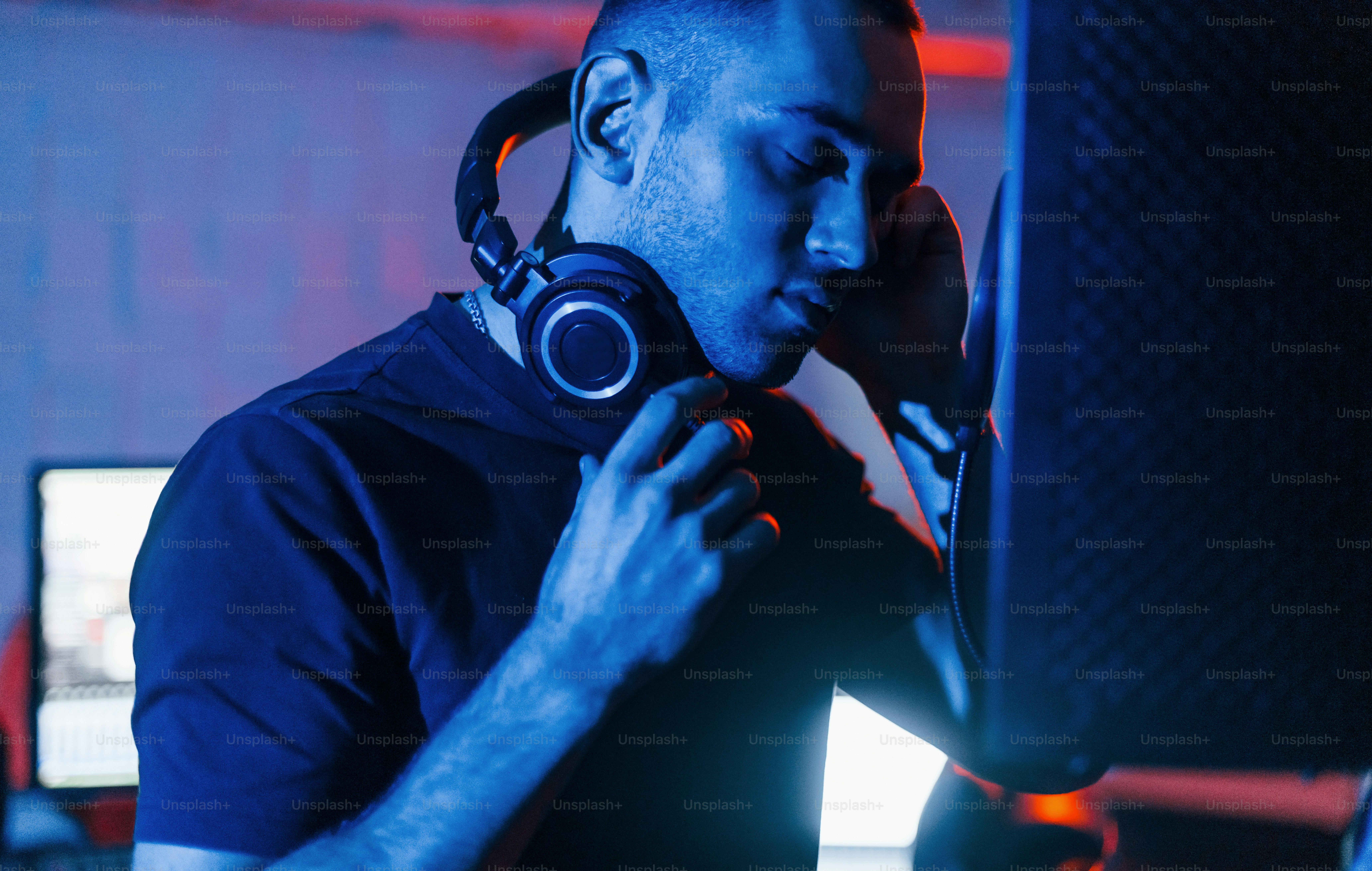 Vocalist have recording session indoors in the modern professional ...
