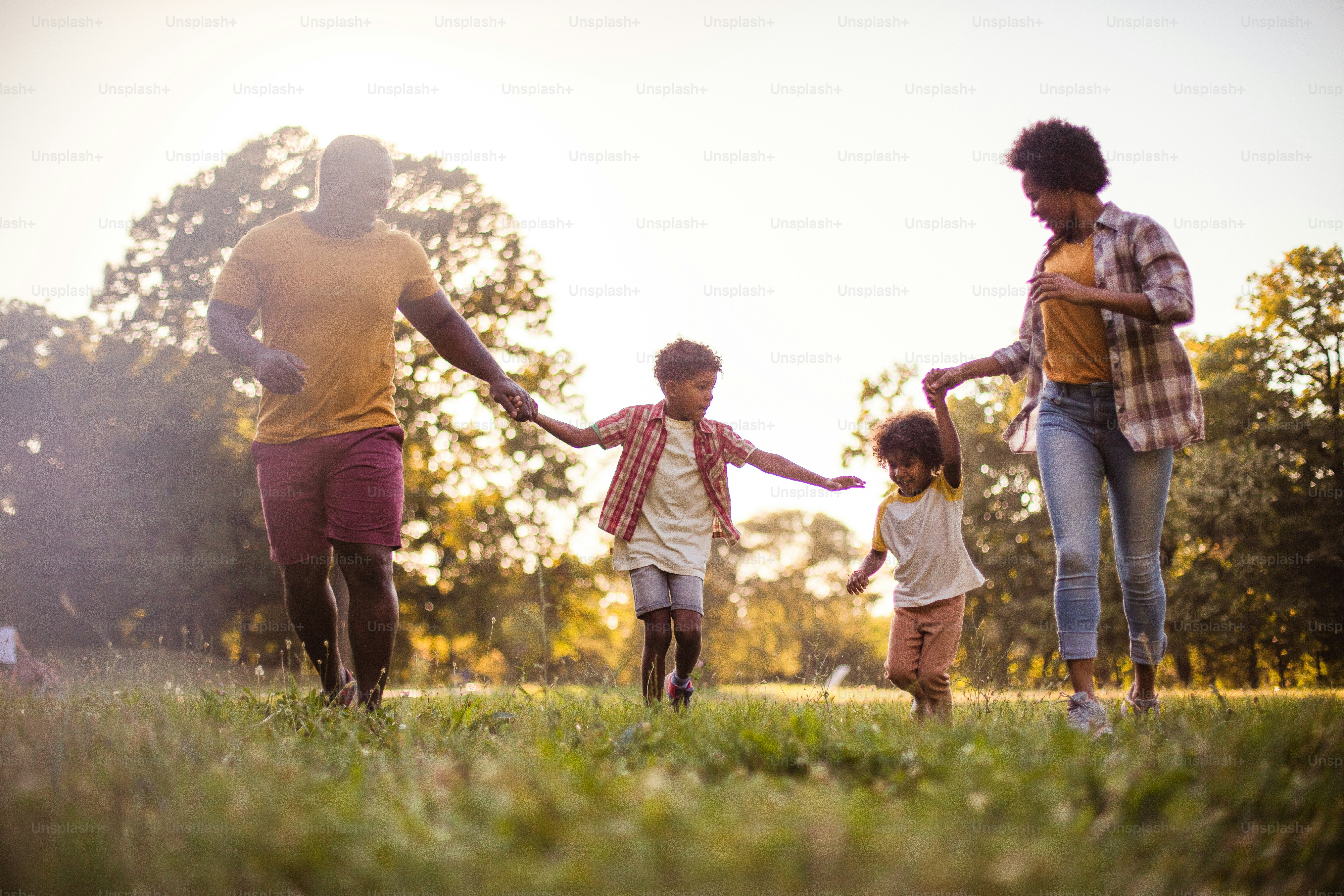 Family having fun. African American family on toboggan. photo – African ...