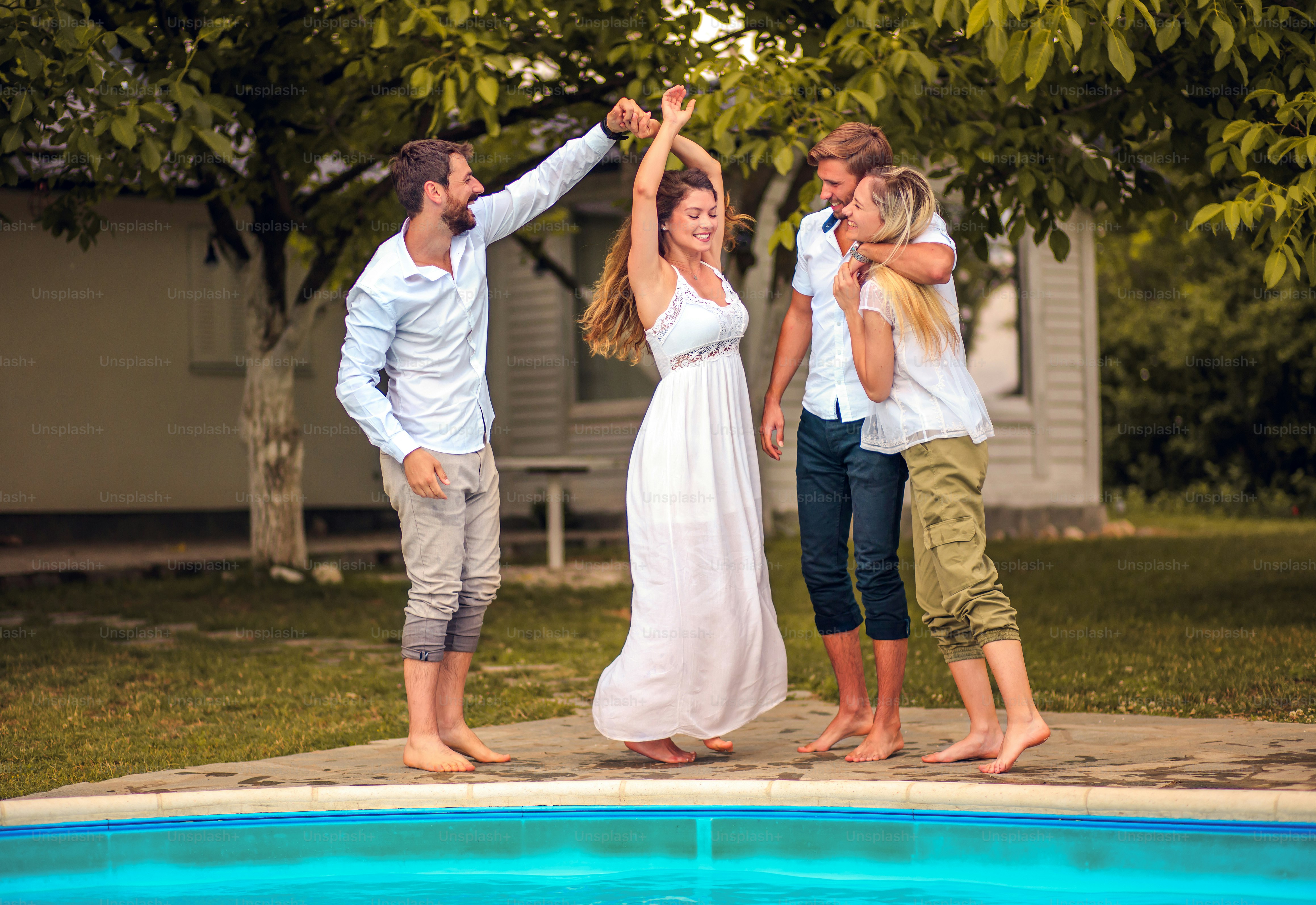 Friends having fun by the pool. photo – Girlfriend and boyfriend Image ...