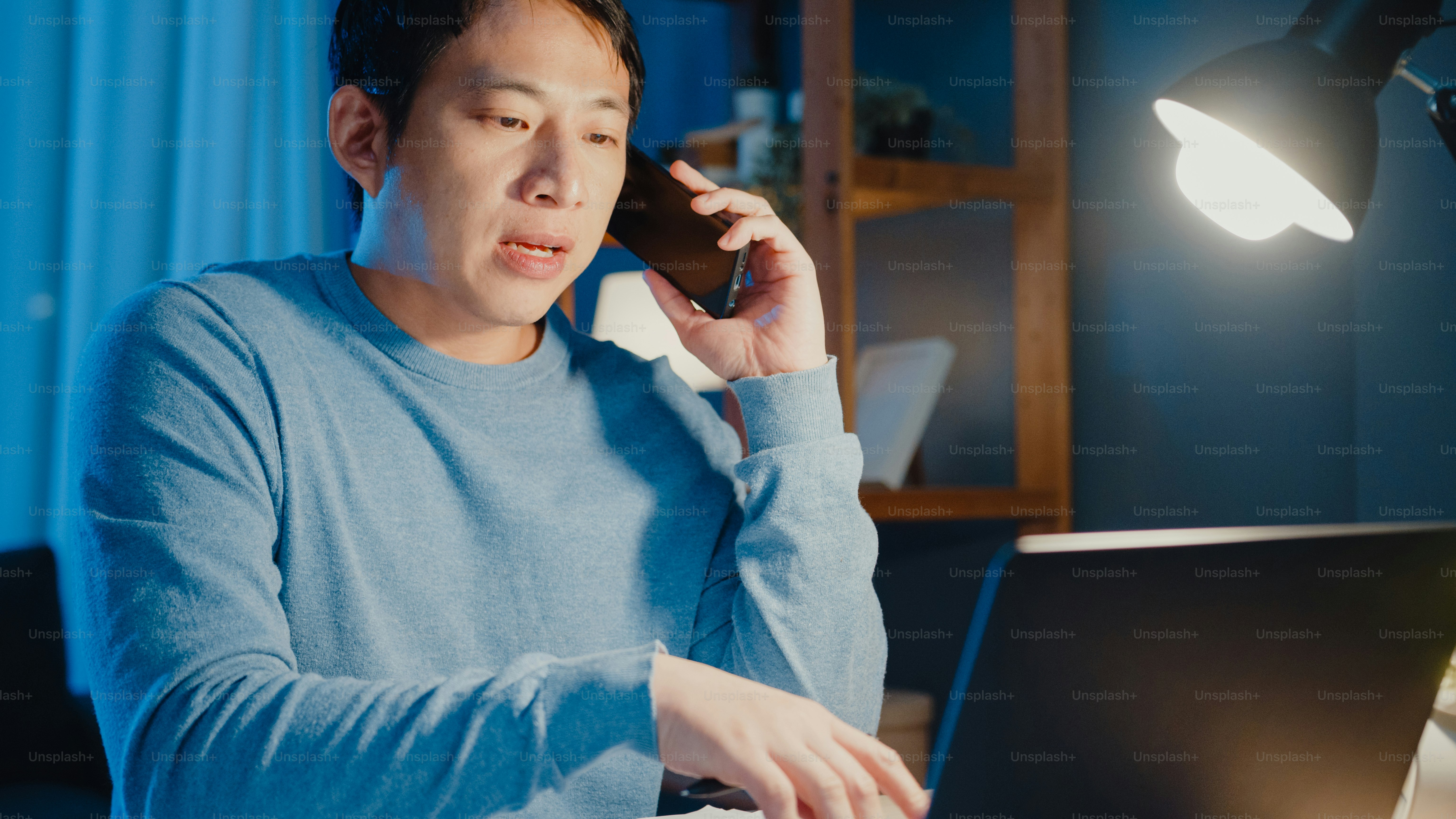 Young Asia businessman use smartphone call meeting agenda assignment ...