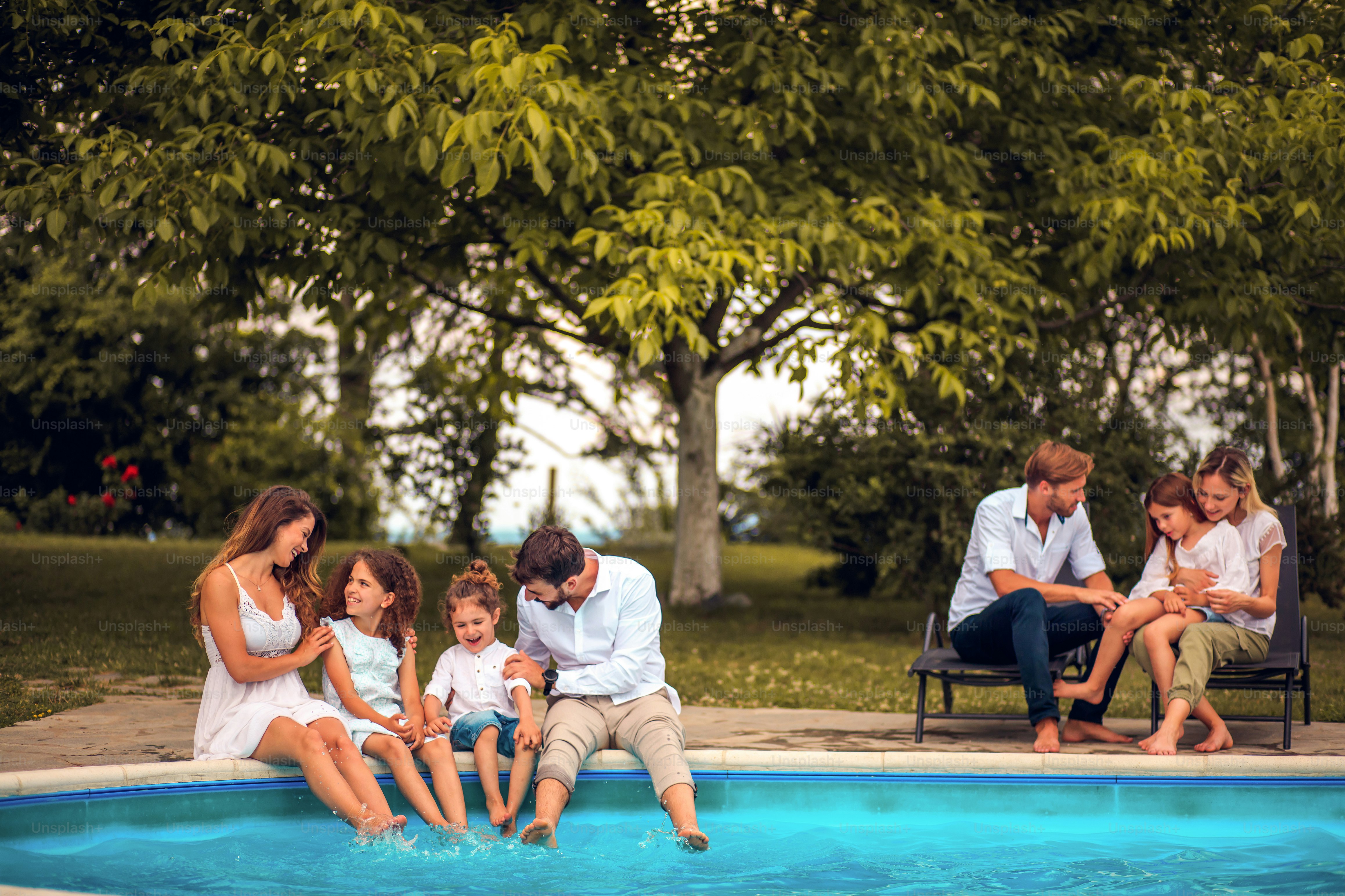 Large group of people sitting by the swimming pool. photo – Free Summer ...