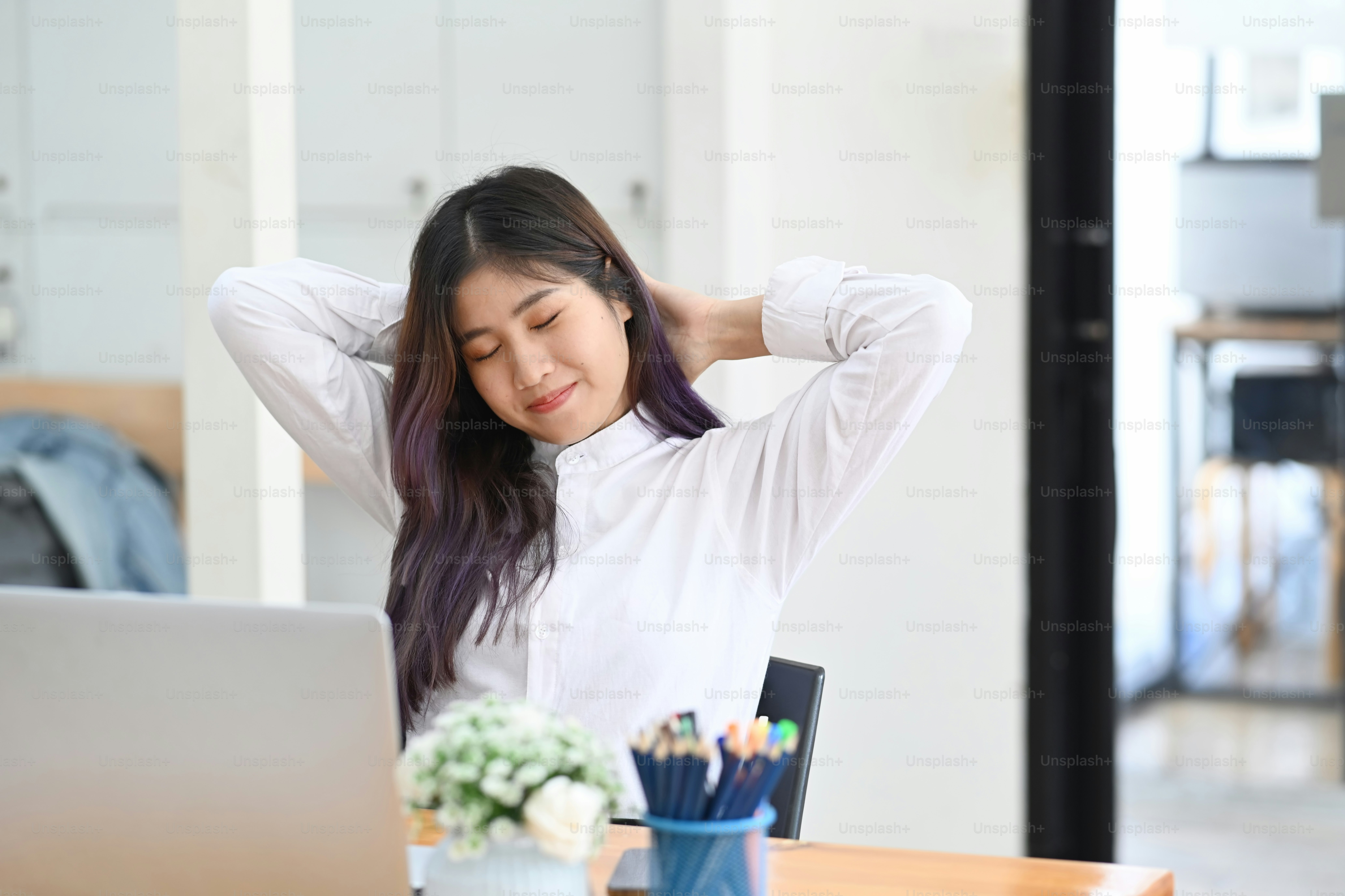 Happy woman office worker resting at comfortable office chair. photo ...