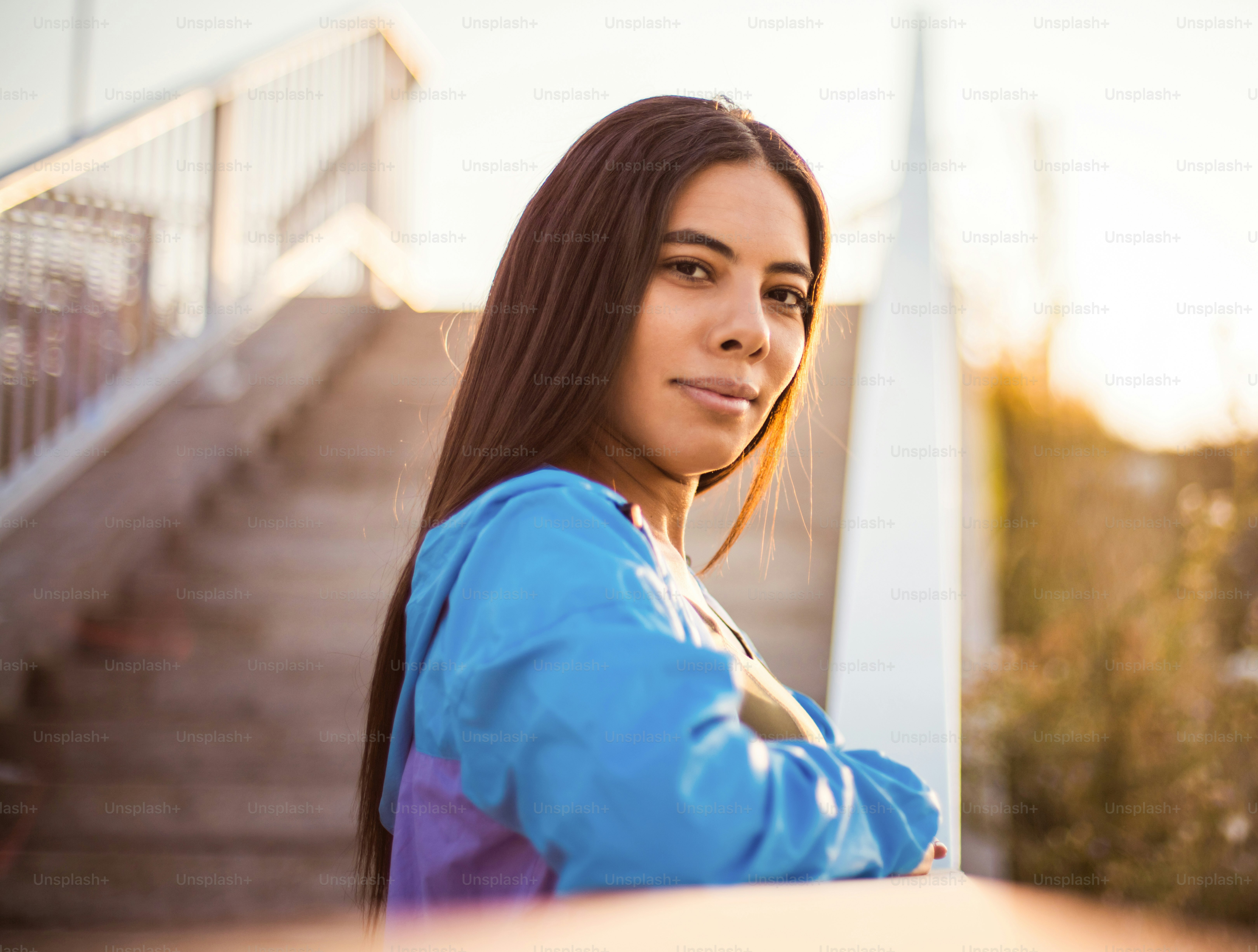 Sporty woman standing outside and looking at camera. photo – African ...