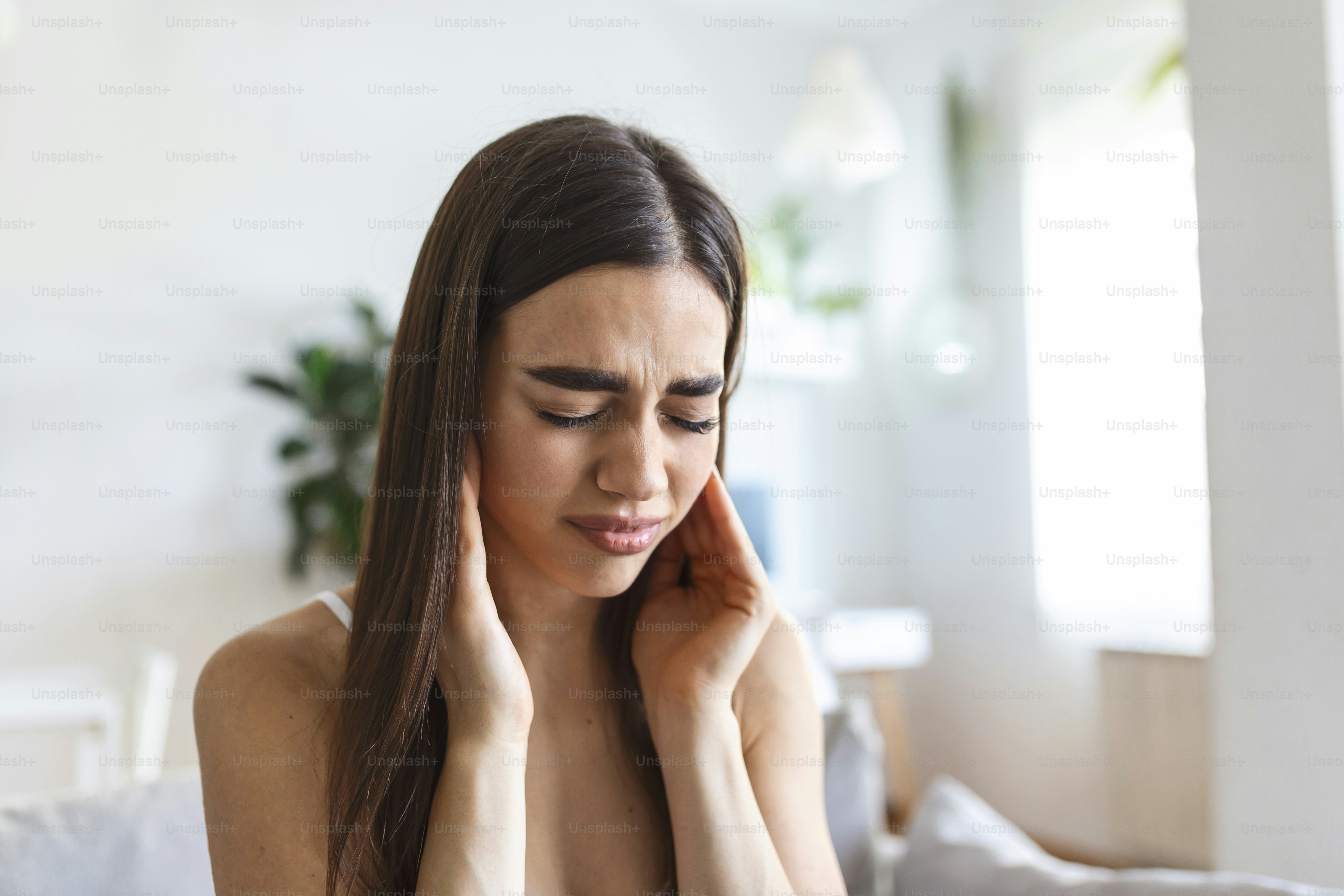 Portrait of unhappy caucasian woman suffering from toothache at home ...