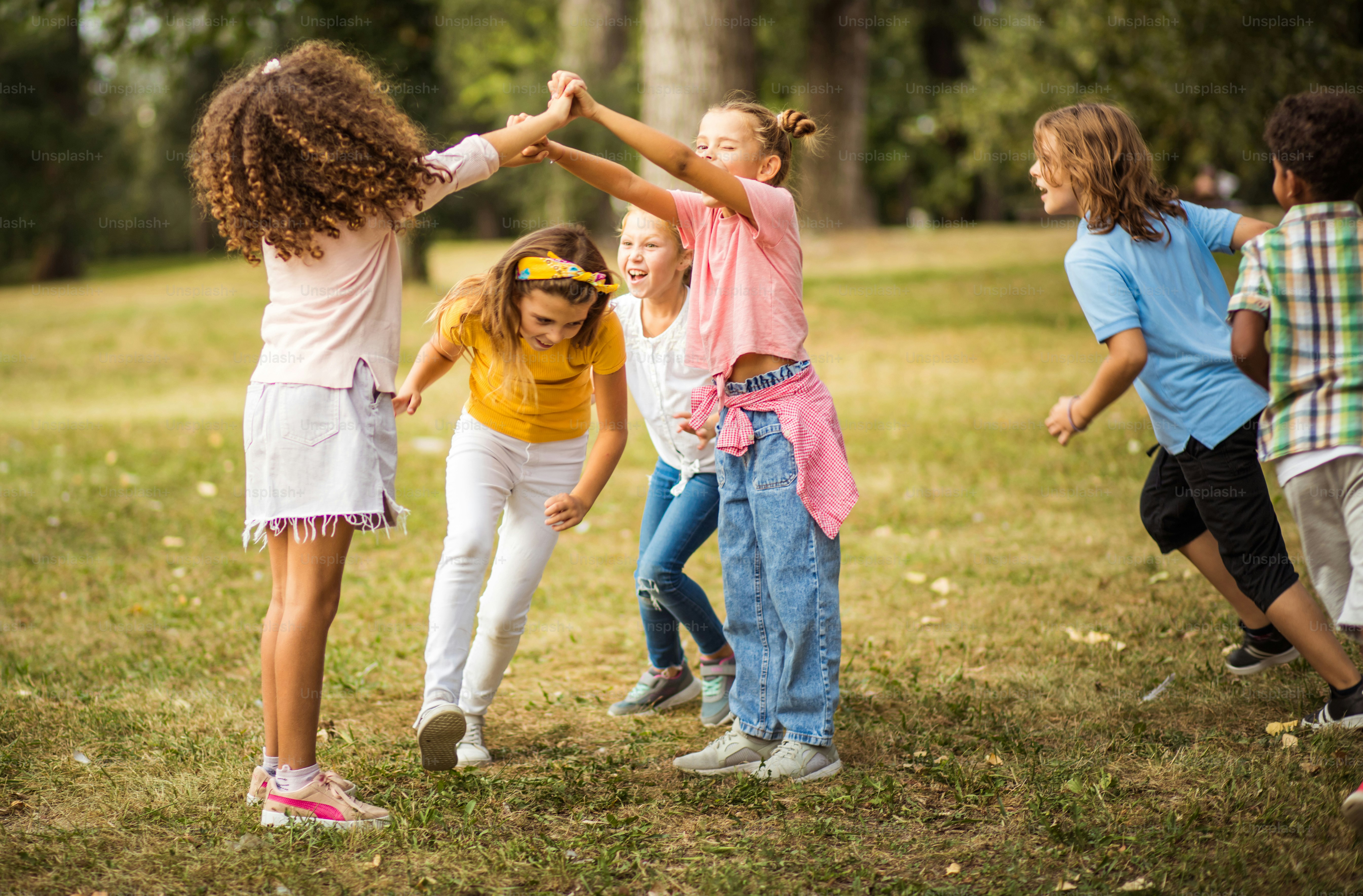 Large group of school kids having fun in nature. photo – Elementary ...