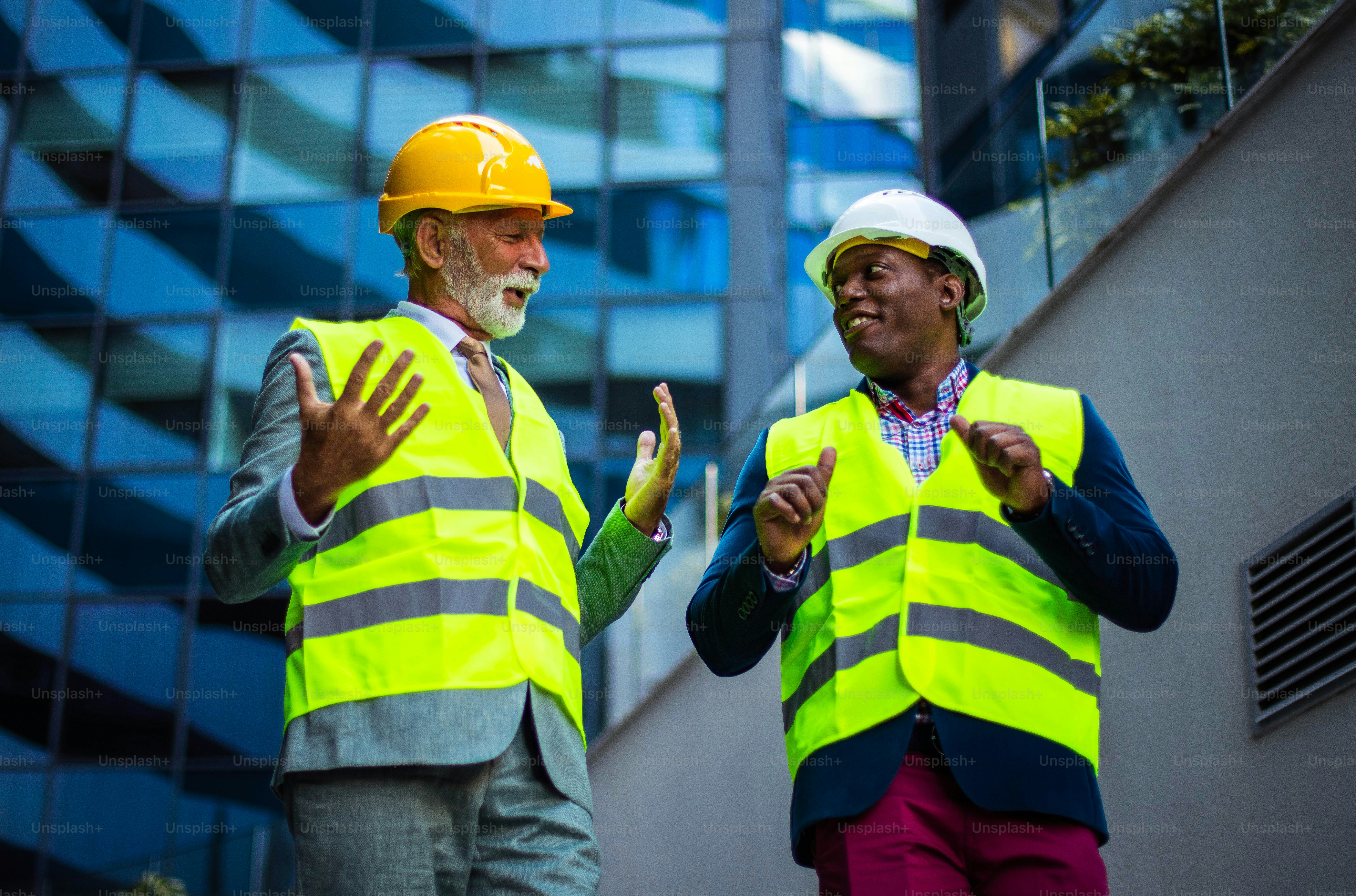 Engineer discussing the structure of the building with architects ...