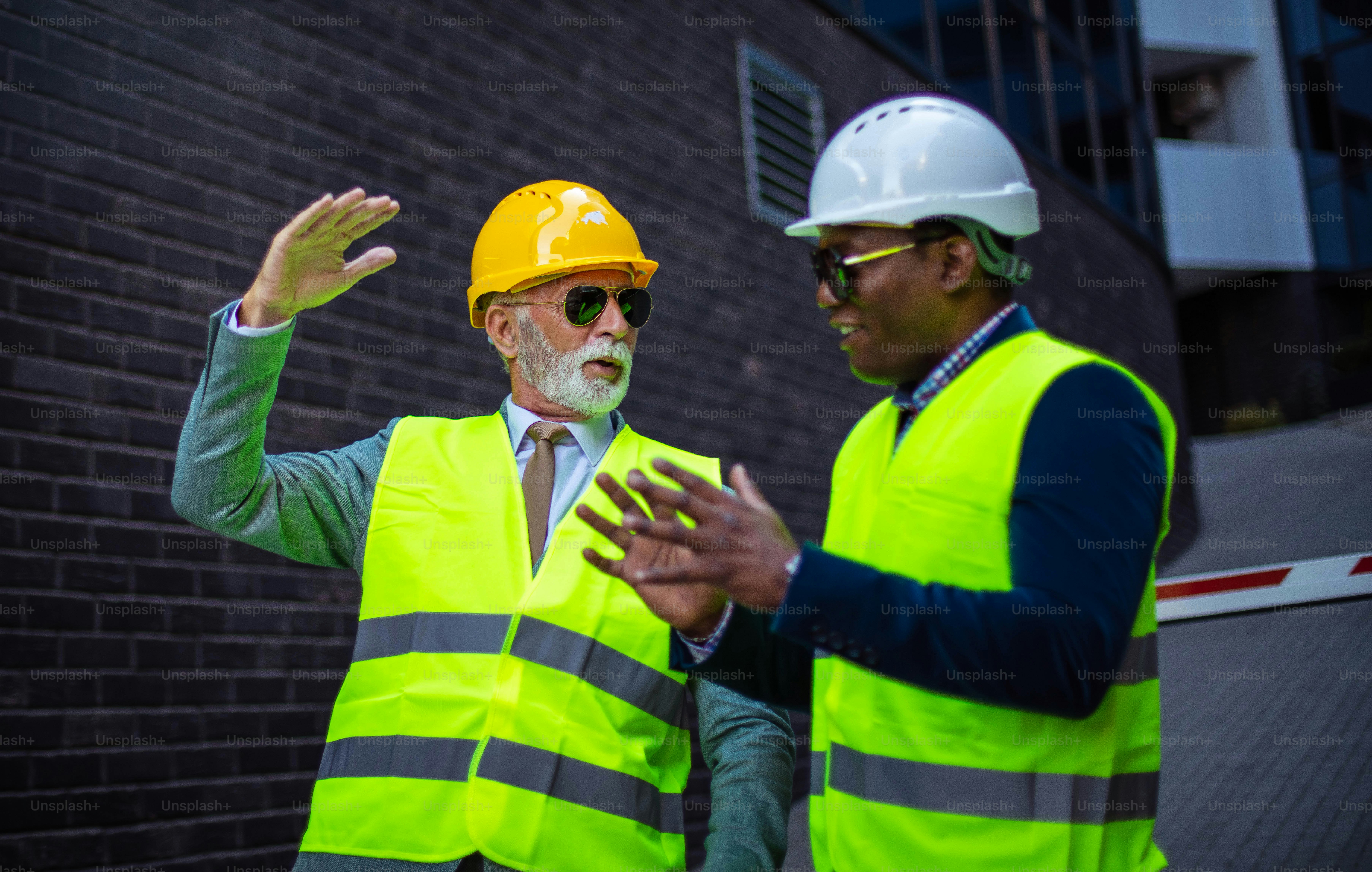 Engineer discussing the structure of the building with architects ...