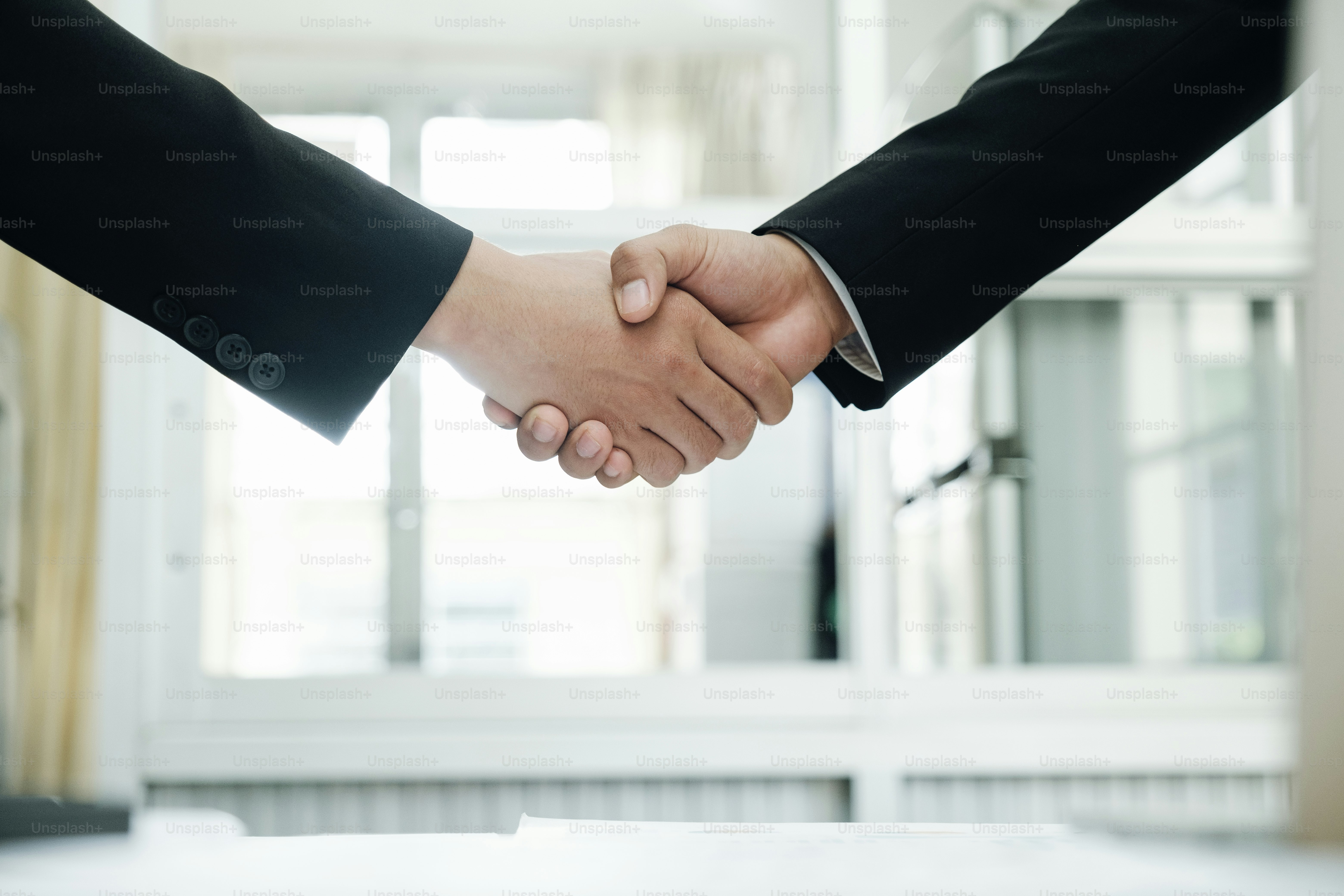 Businessmans handshake. Successful businessmen handshaking after good ...