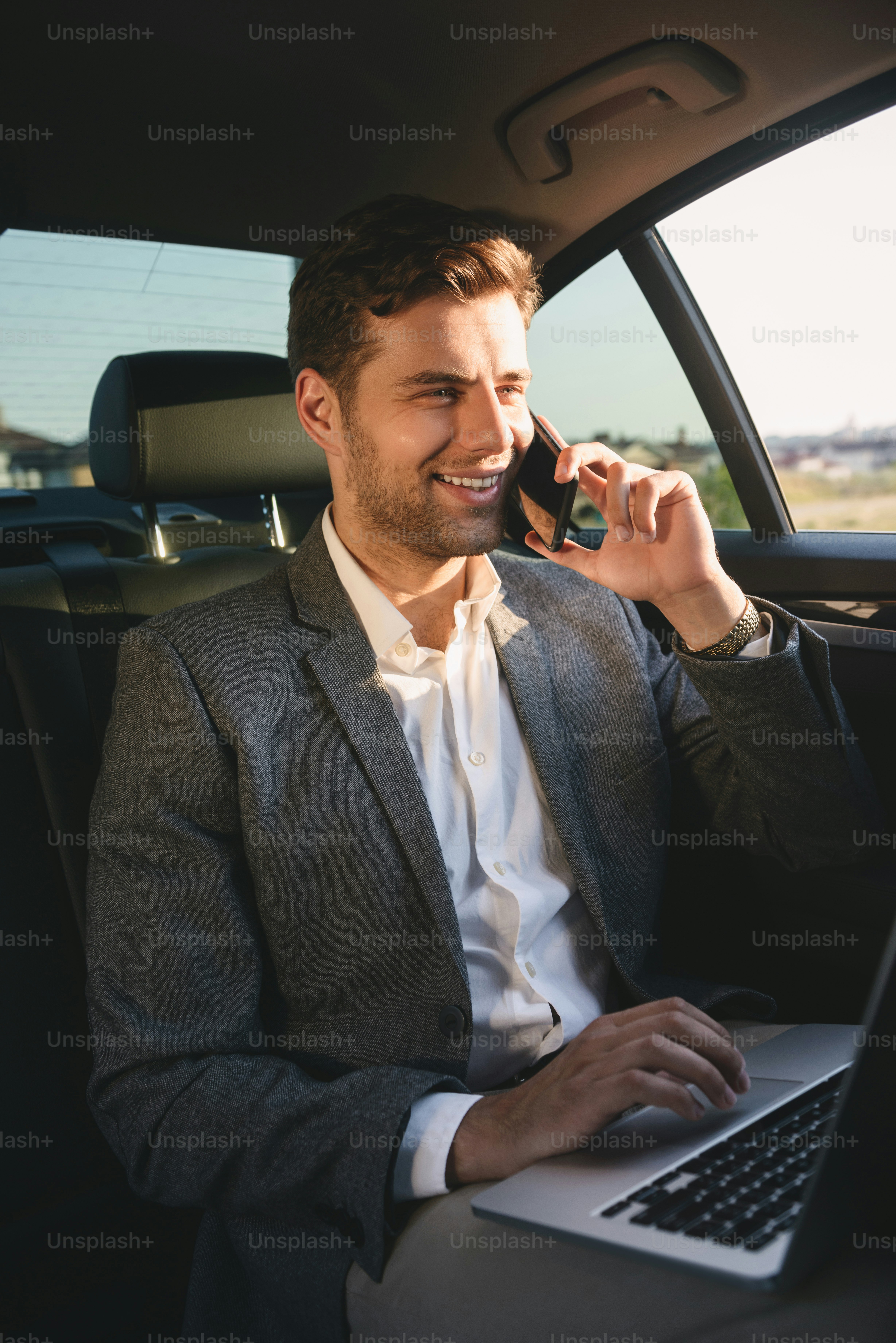 Image of successful director man in suit talking on smartphone and ...
