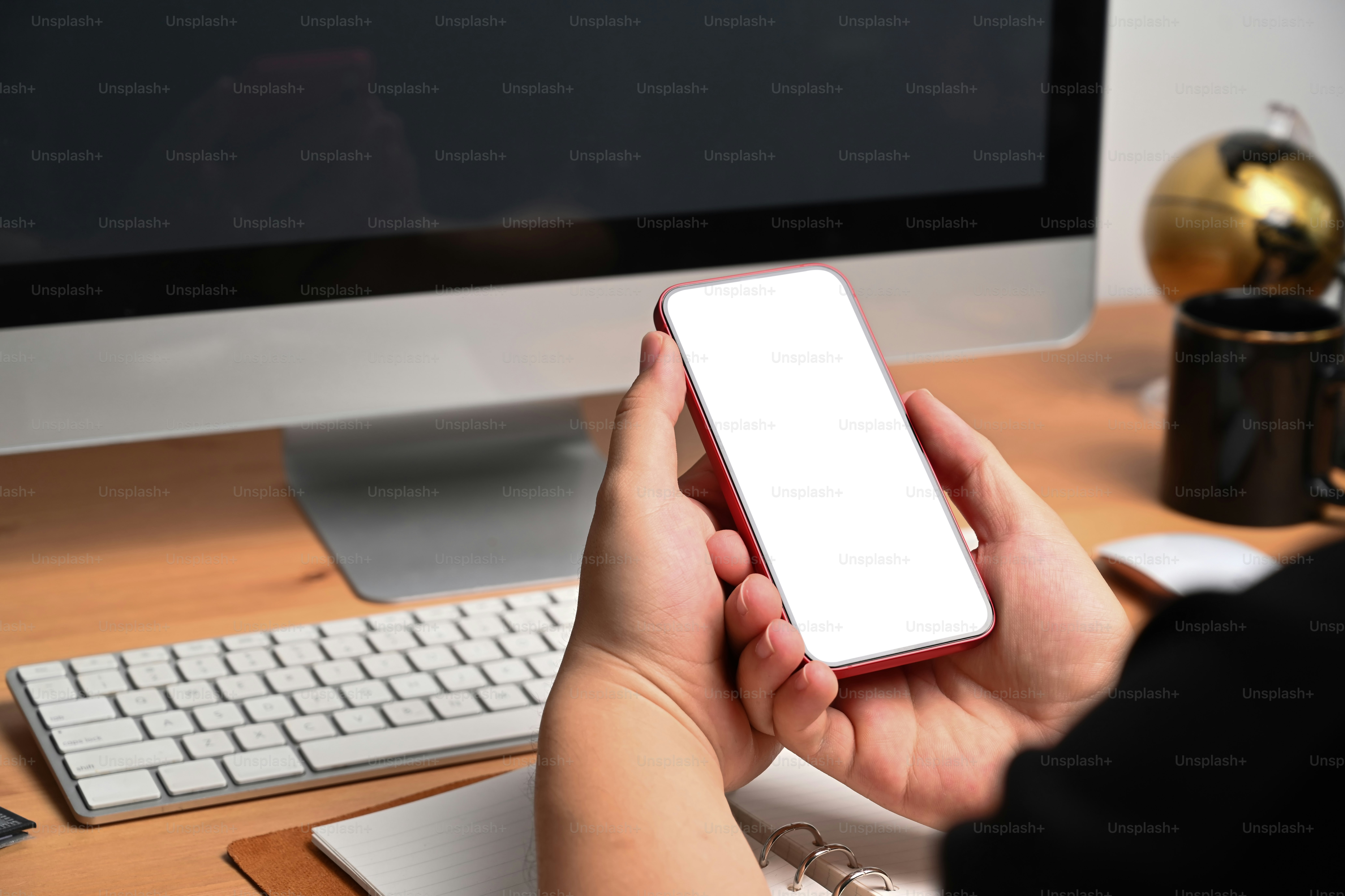 Close up view man holding mock up mobile phone with empty screen. photo ...