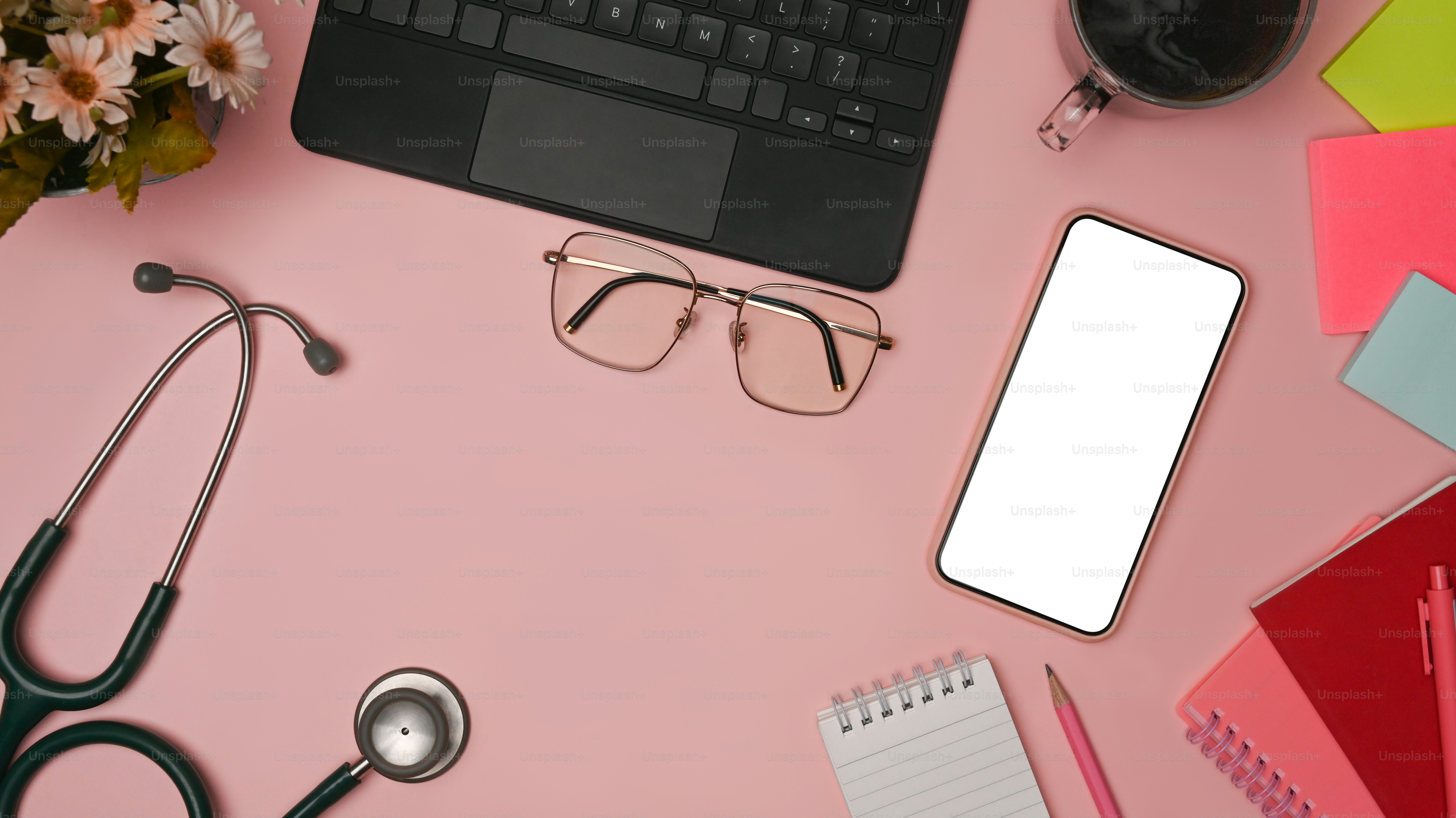 Doctor workspace with stethoscope, smart phone computer laptop and ...