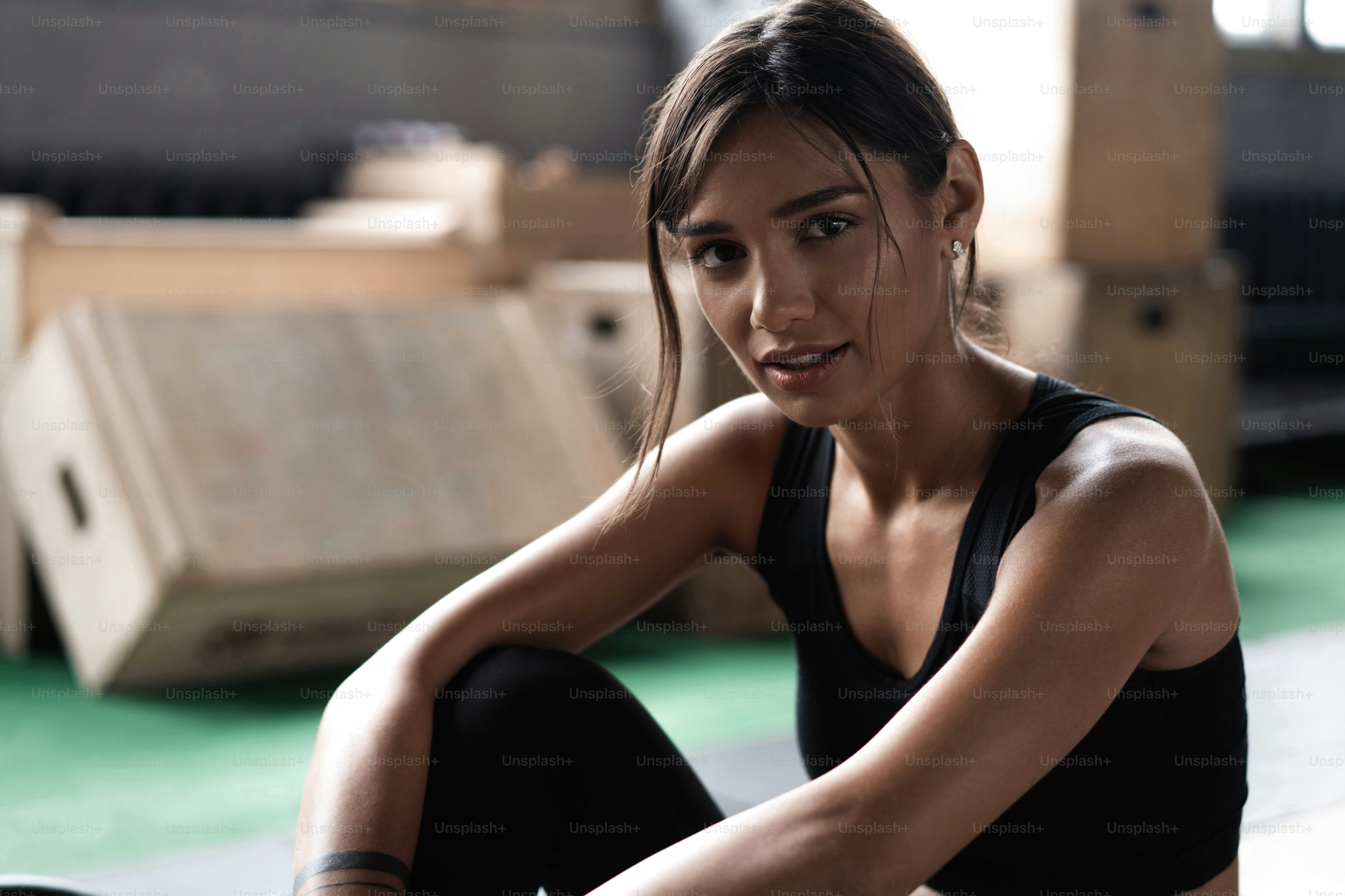 Tired woman having rest after workout. Tired and exhausted female ...
