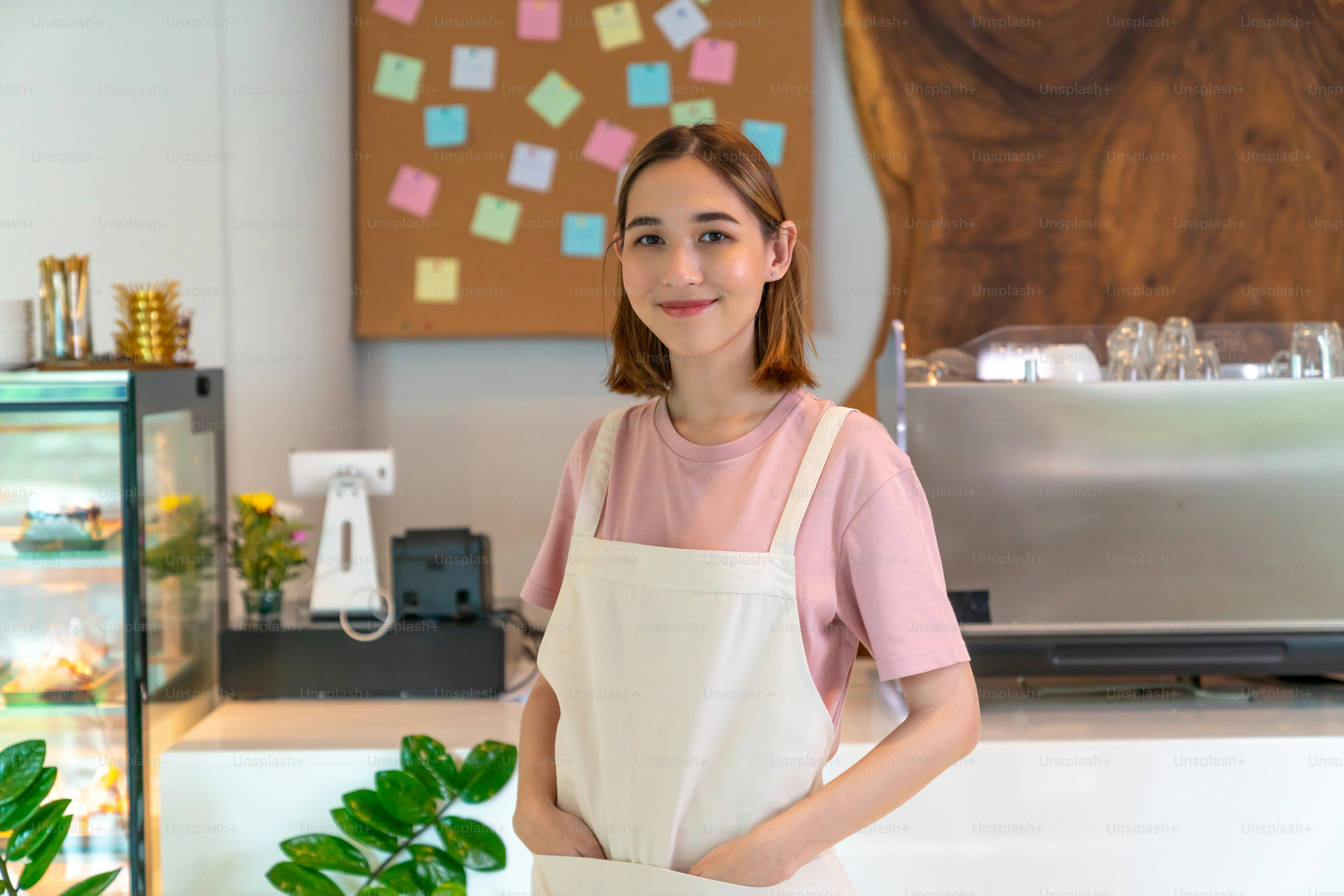 Portrait of Young Asian woman coffee shop waitress standing in front of ...