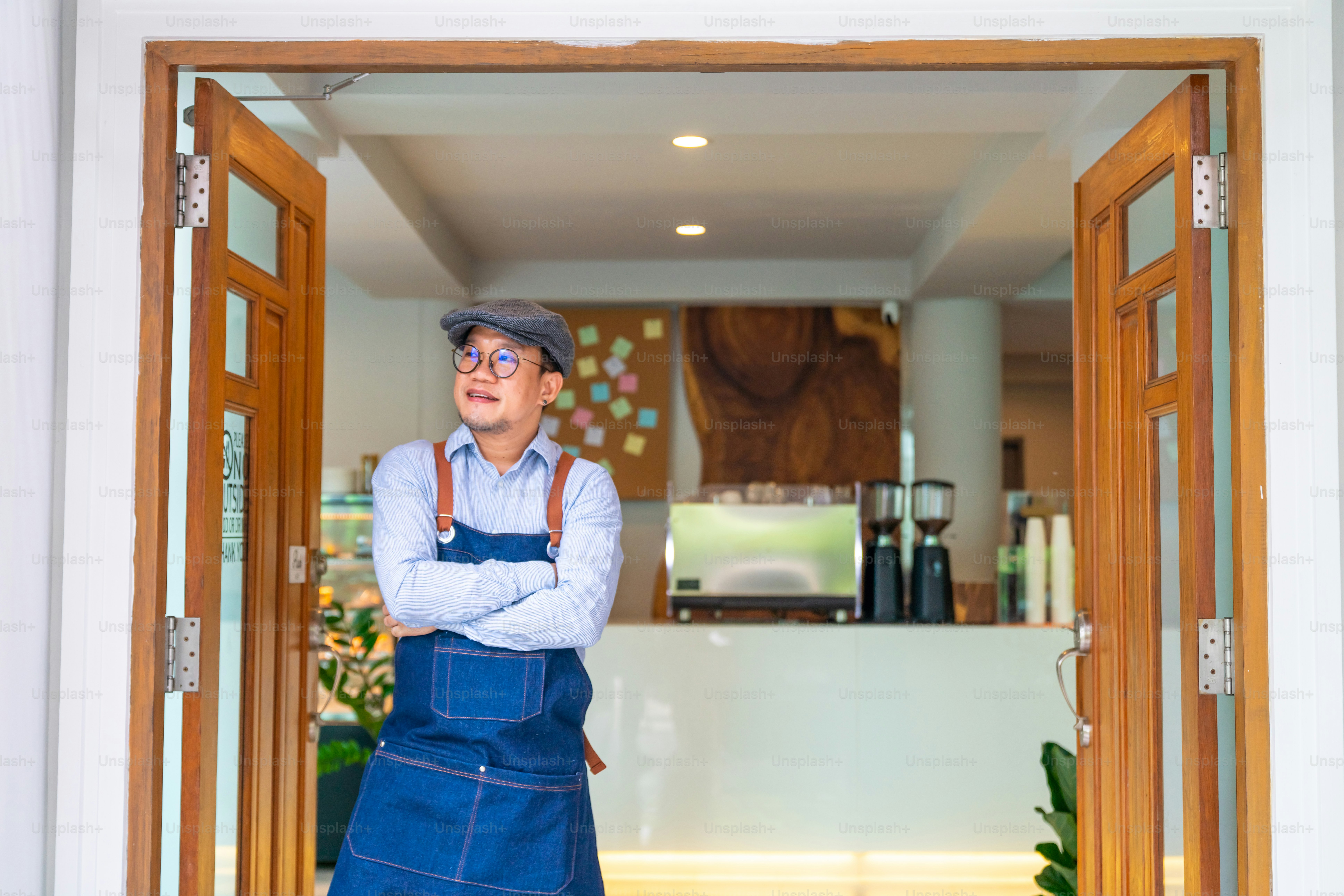 Portrait of Smiling Asian man coffee shop manager open shop door and ...