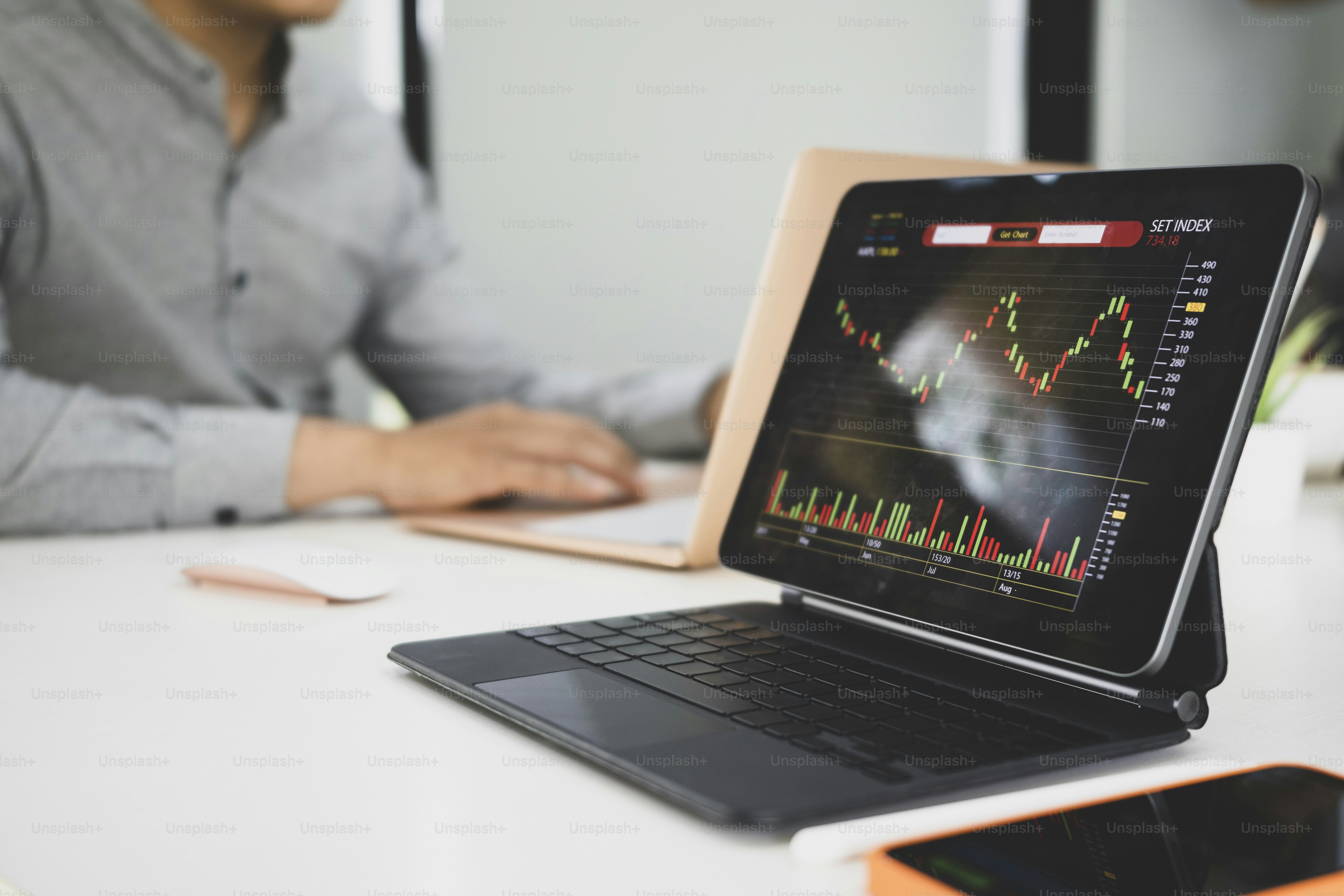 Statistics graphs on screen of computer tablet desktop. photo – Trader ...